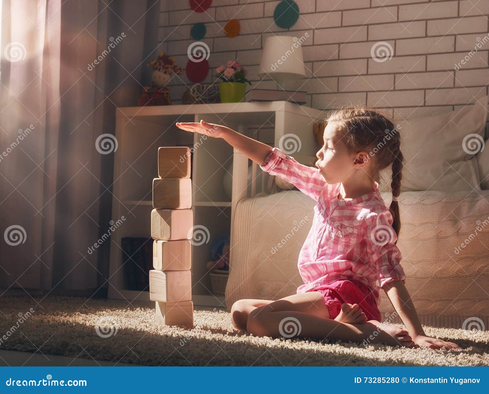 Girl playing with blocks stock photo. Image of designer - 73285280