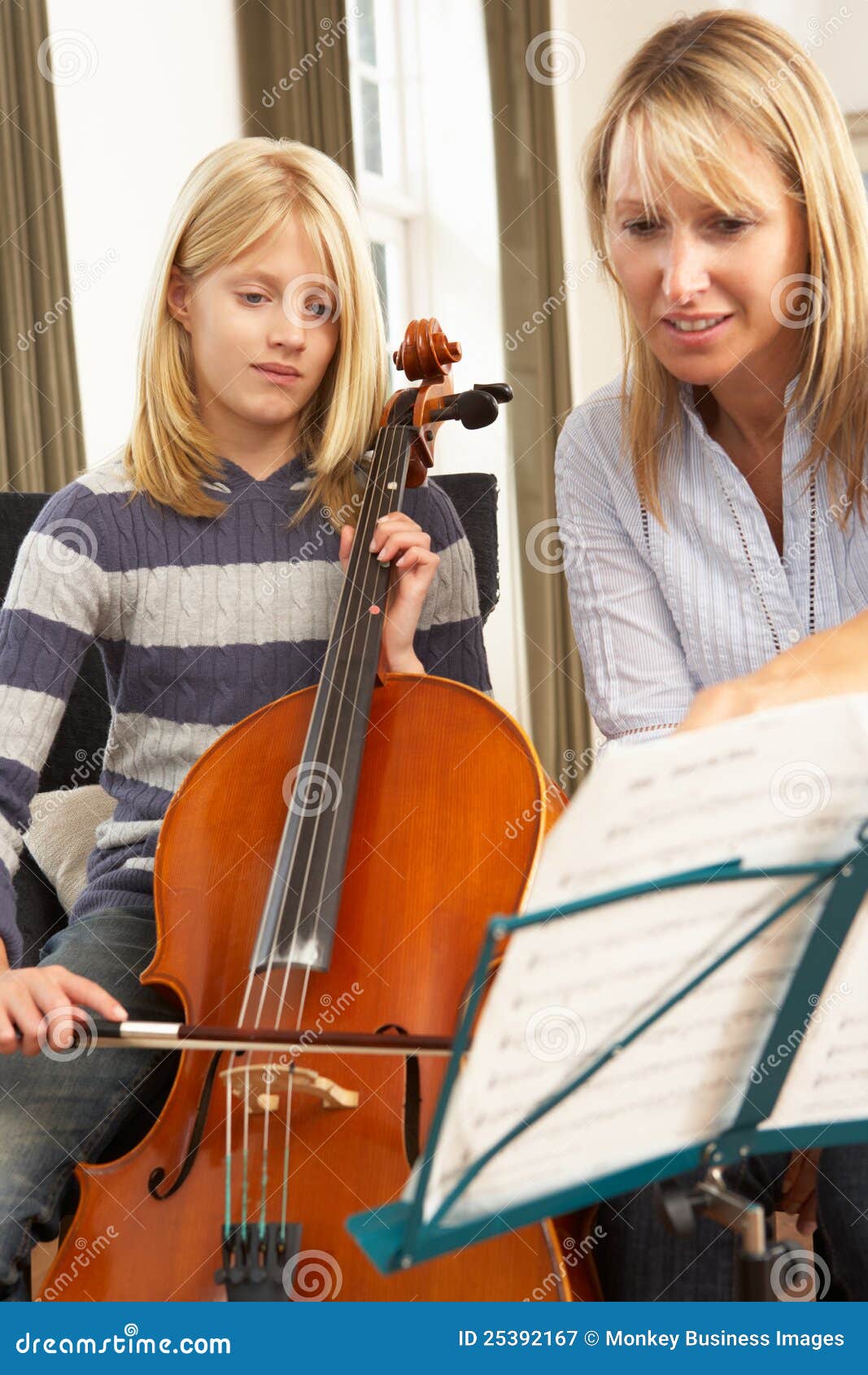 Girl Playing Cello in Music Lesson Stock Image - Image of reading ...