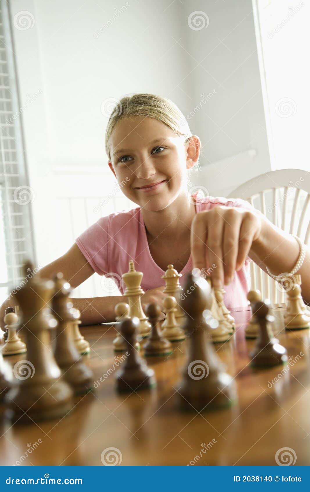 Girl playing chess. stock photo. Image of head, smiling - 2038140