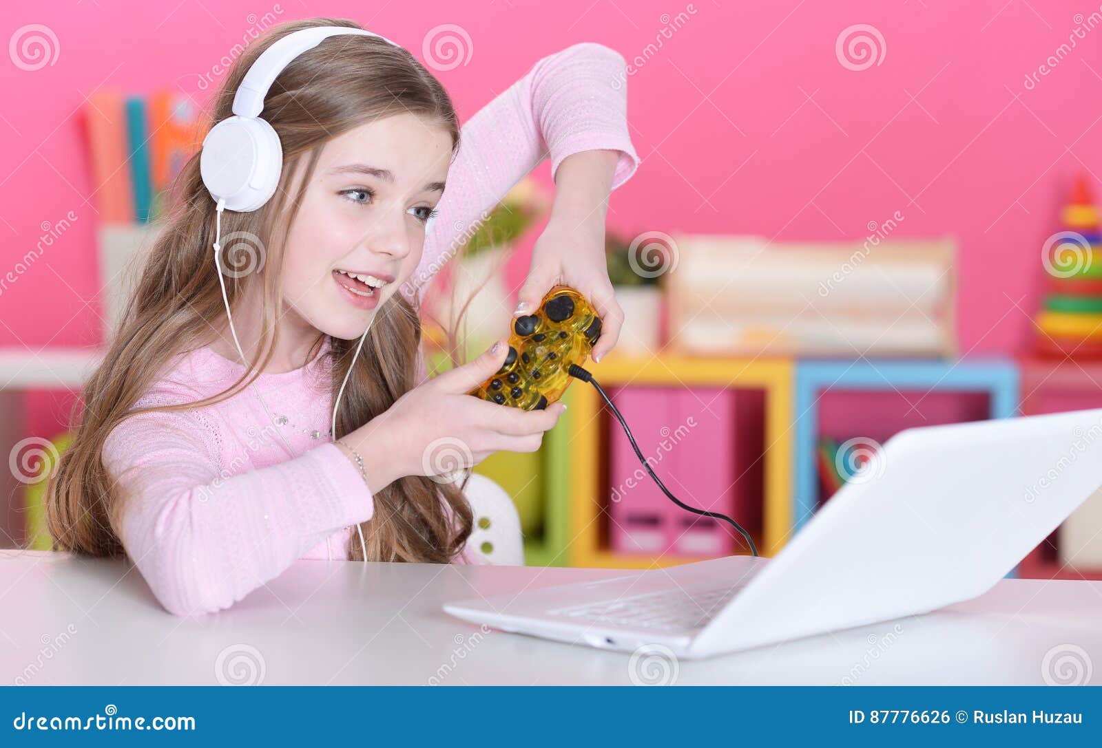 Girl Playing a Computer Game Stock Photo - Image of notebook ...