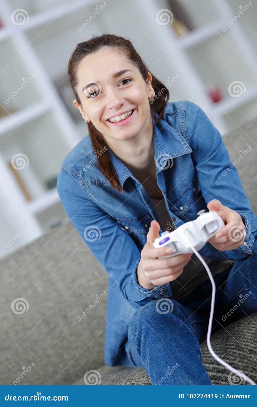 Girl playing on console stock image. Image of activity - 102274419