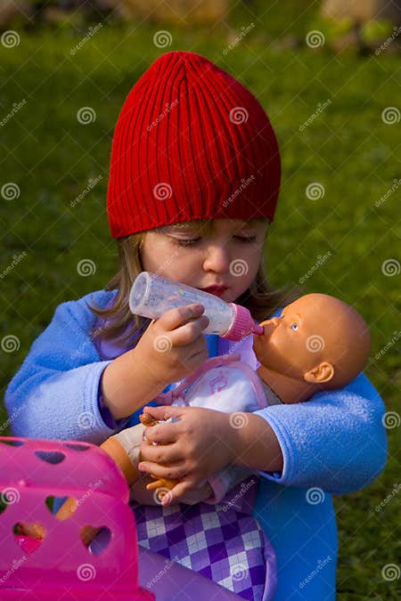 Girl playing with doll stock photo. Image of children - 2808862