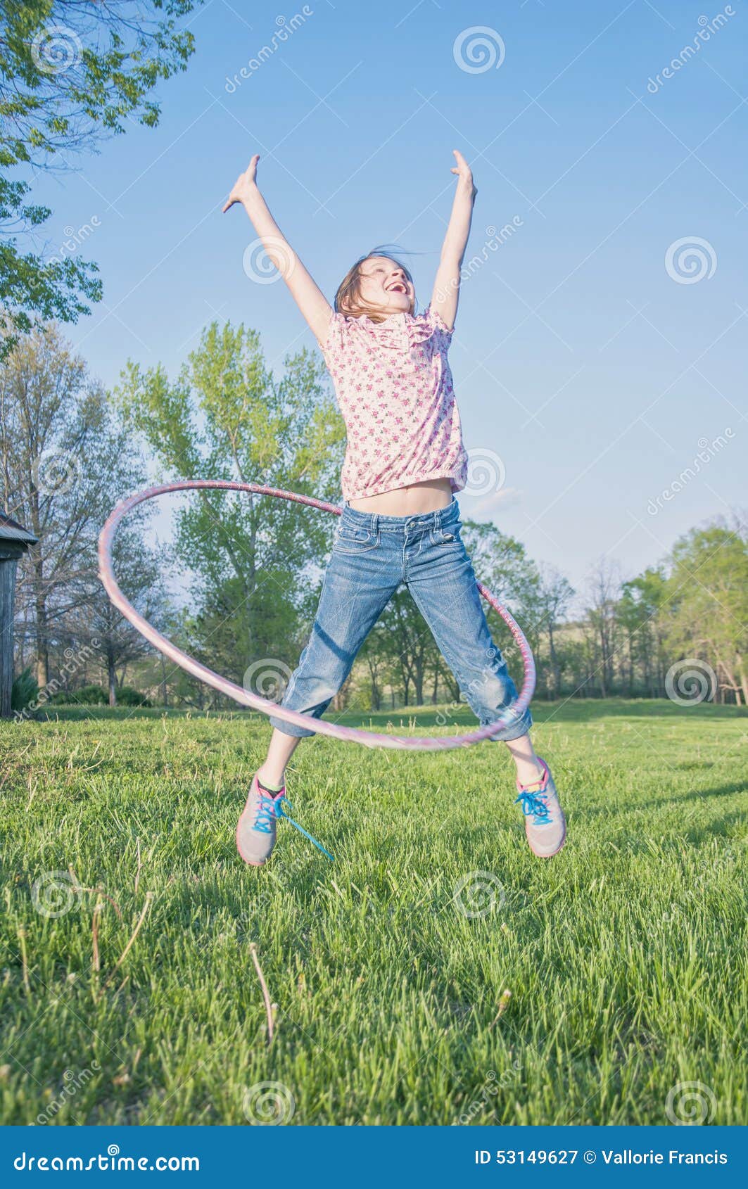 Girl Playing Hoola- Hoop Jumping Stock Image - Image of childhood ...