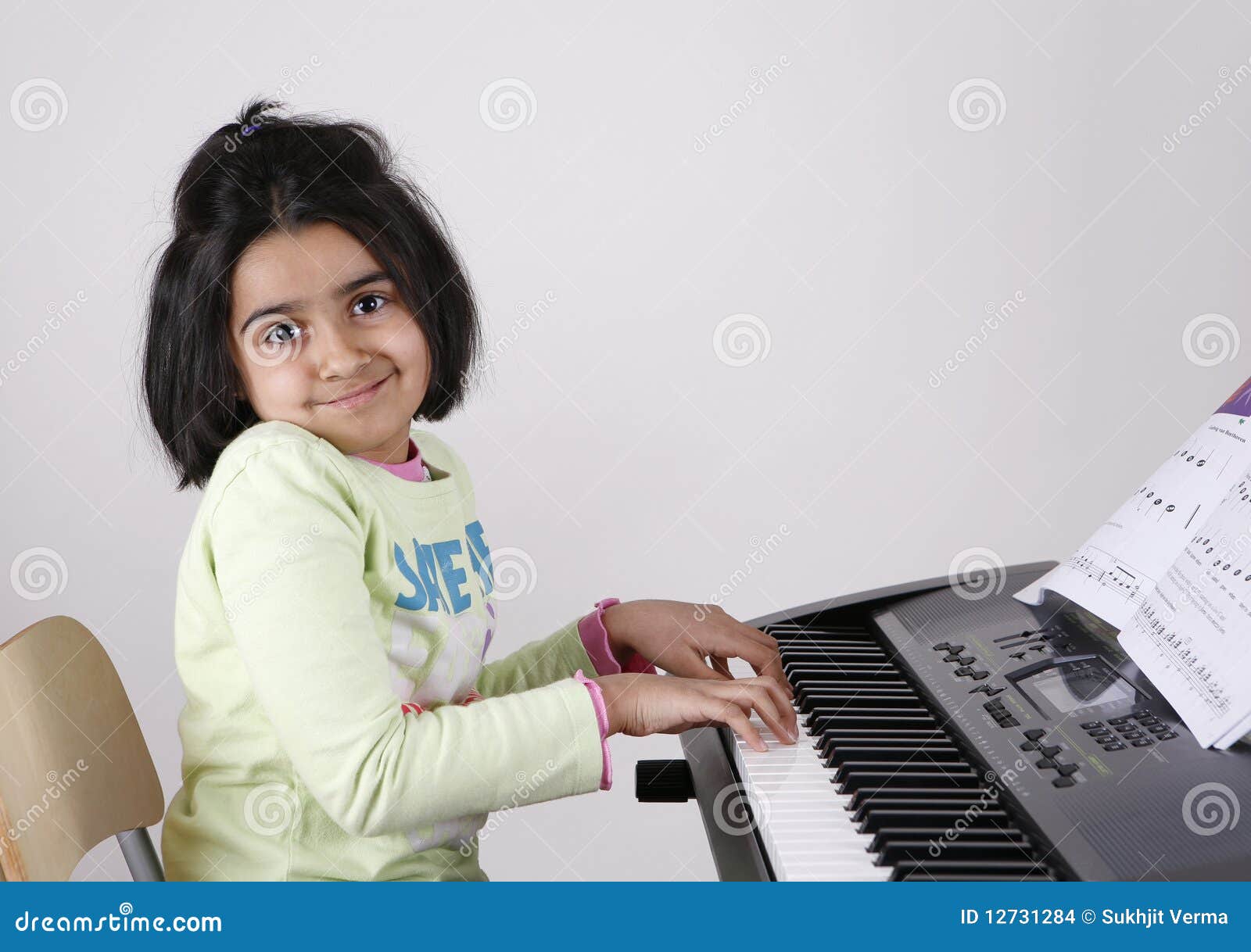 Girl playing keyboard stock photo. Image of formal, cute - 12731284