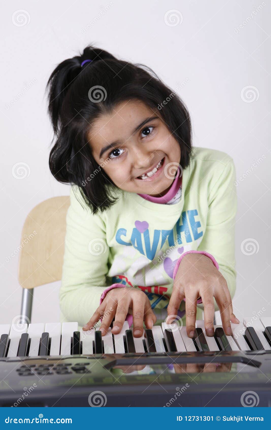 Girl playing keyboard stock image. Image of child, keys - 12731301