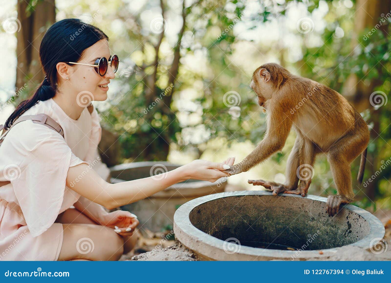 Girl playing with monkey stock photo. Image of baby - 122767394