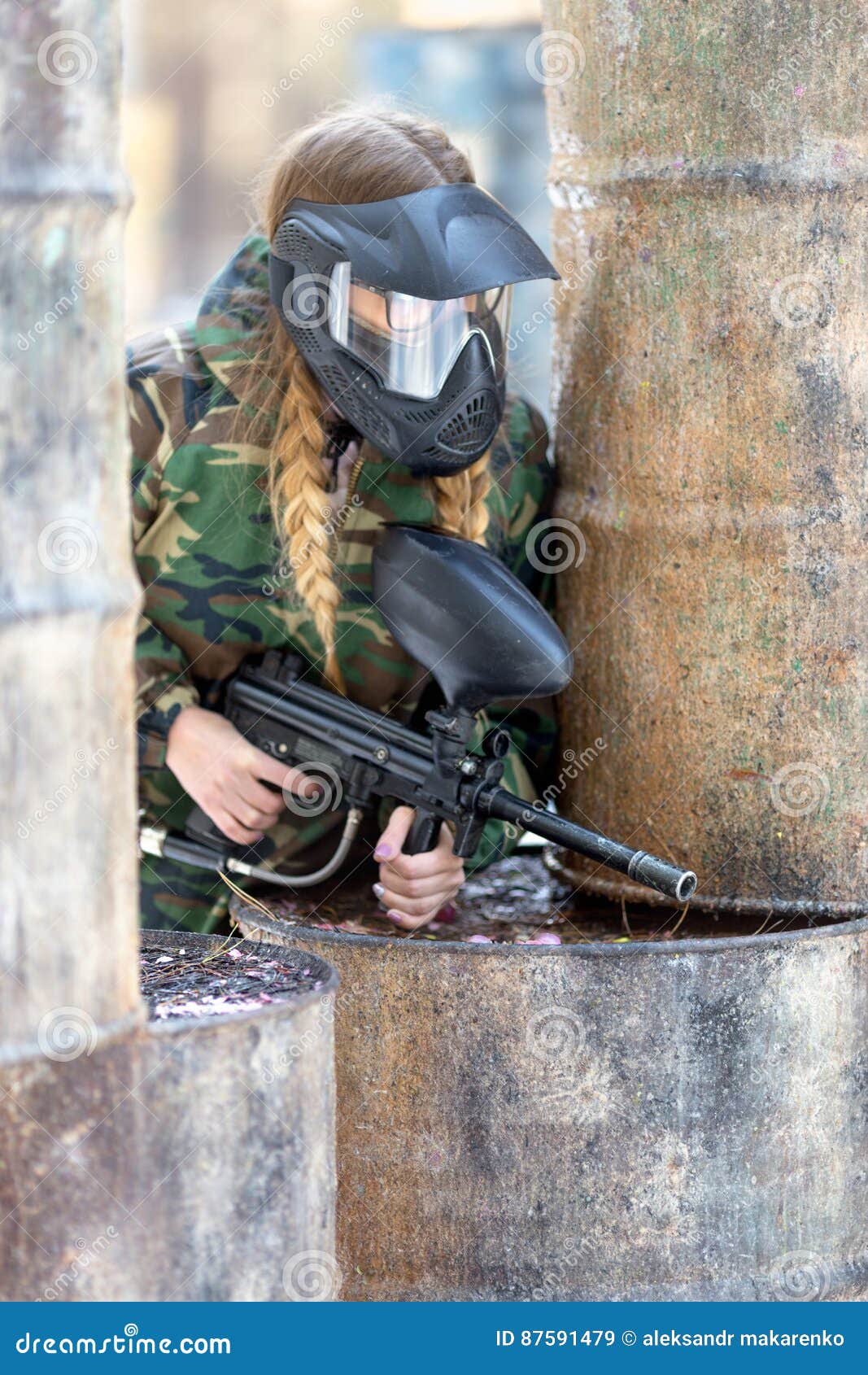 Girl Playing Paintball in Overalls with a Gun. Stock Image - Image of ...