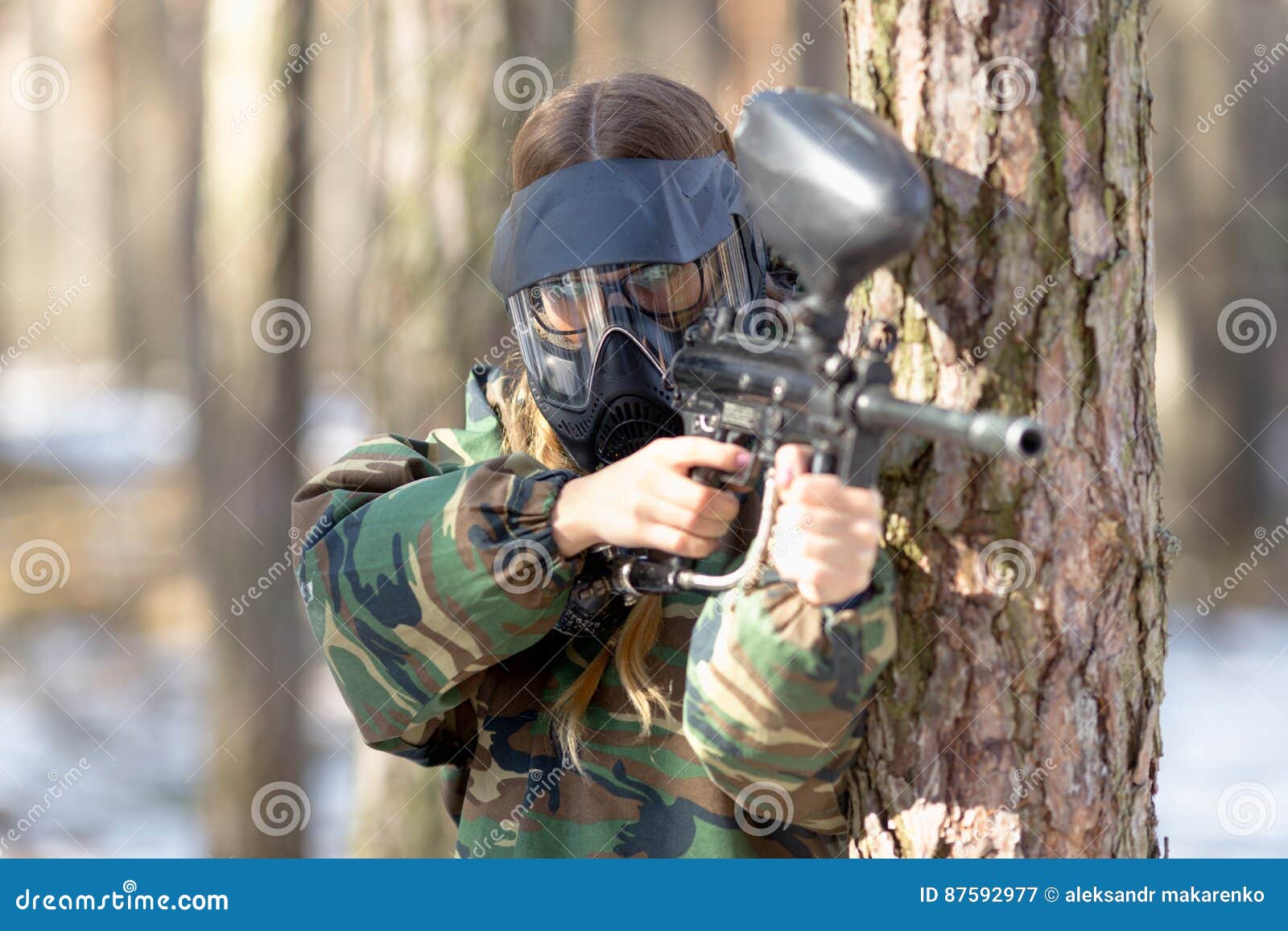 Girl Playing Paintball in Overalls with a Gun. Stock Image - Image of ...