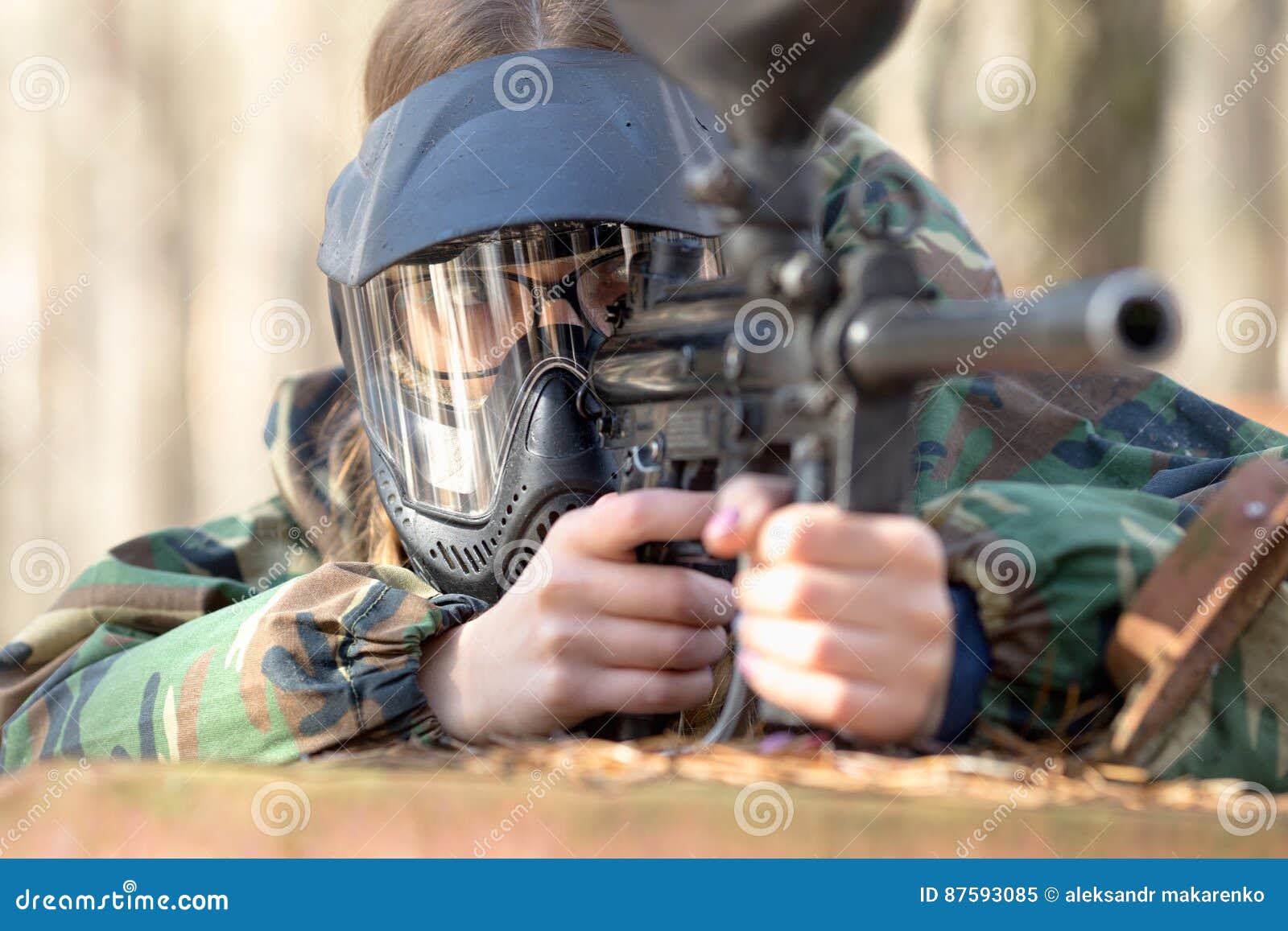 Girl Playing Paintball in Overalls with a Gun. Stock Image - Image of ...