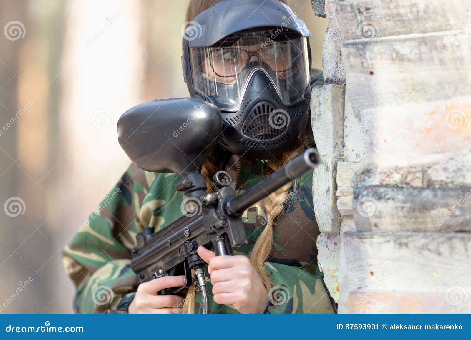 Girl Playing Paintball in Overalls with a Gun. Stock Image - Image of ...