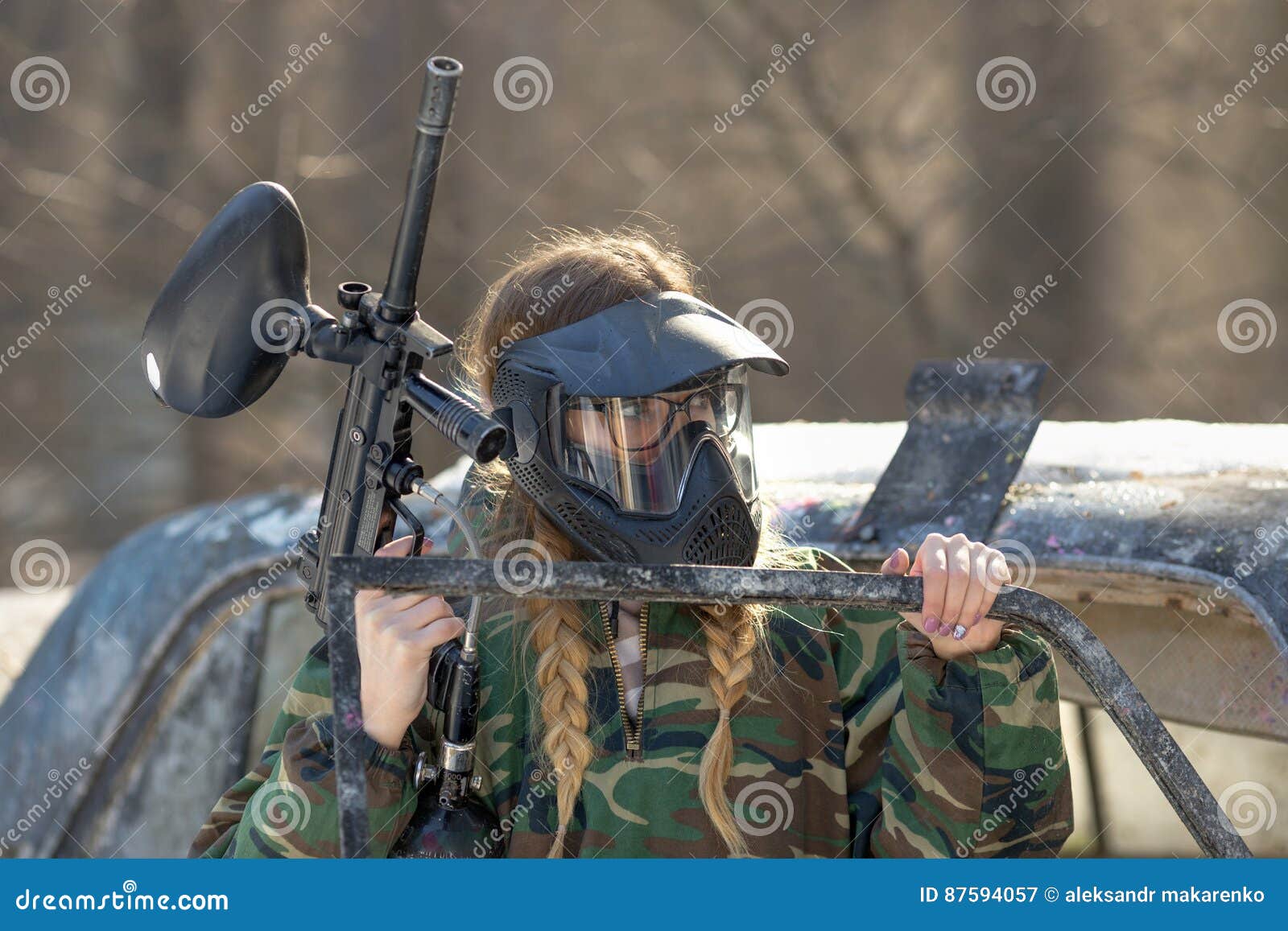 Girl Playing Paintball in Overalls with a Gun. Stock Image - Image of ...