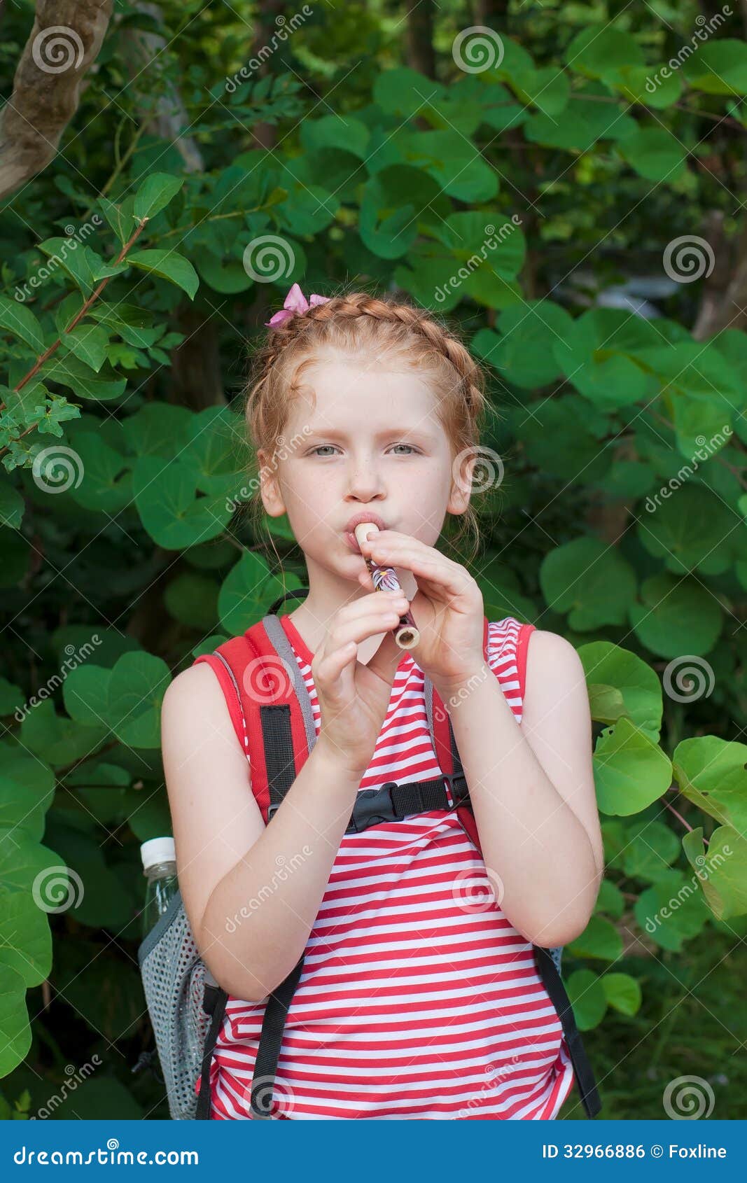 Girl playing a pipe stock photo. Image of attractive - 32966886