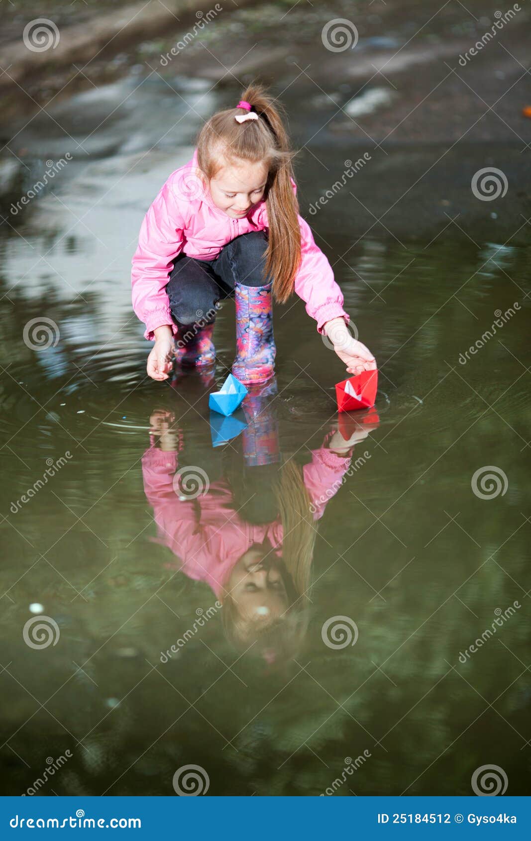 Girl Playing In Puddle Stock Photography - Image: 25184512