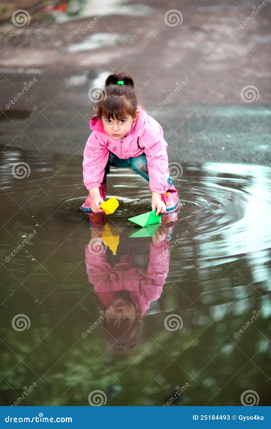 Girl playing in puddles stock image. Image of child, happy - 25184493