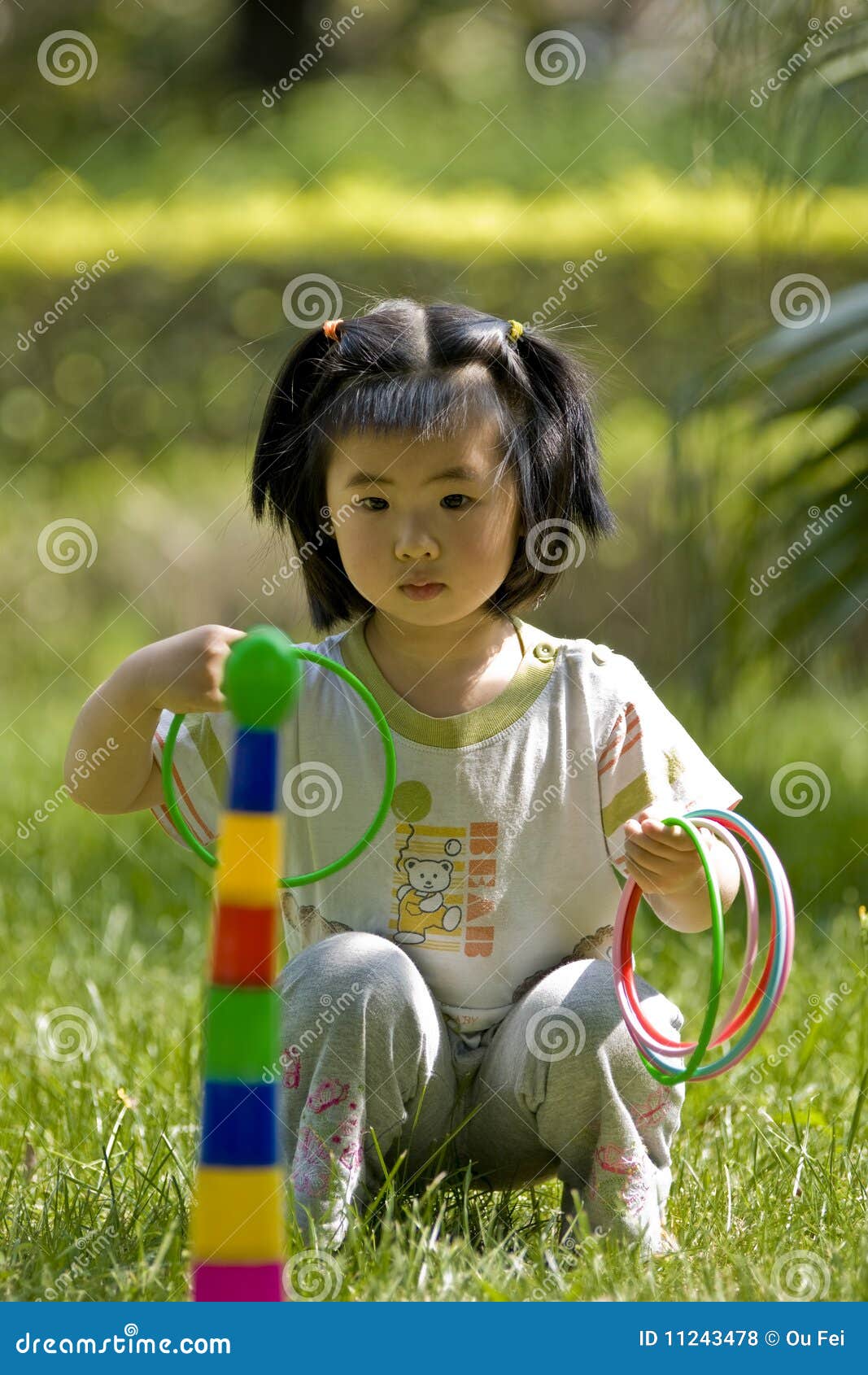Girl playing quoits stock photo. Image of rings, asian - 11243478