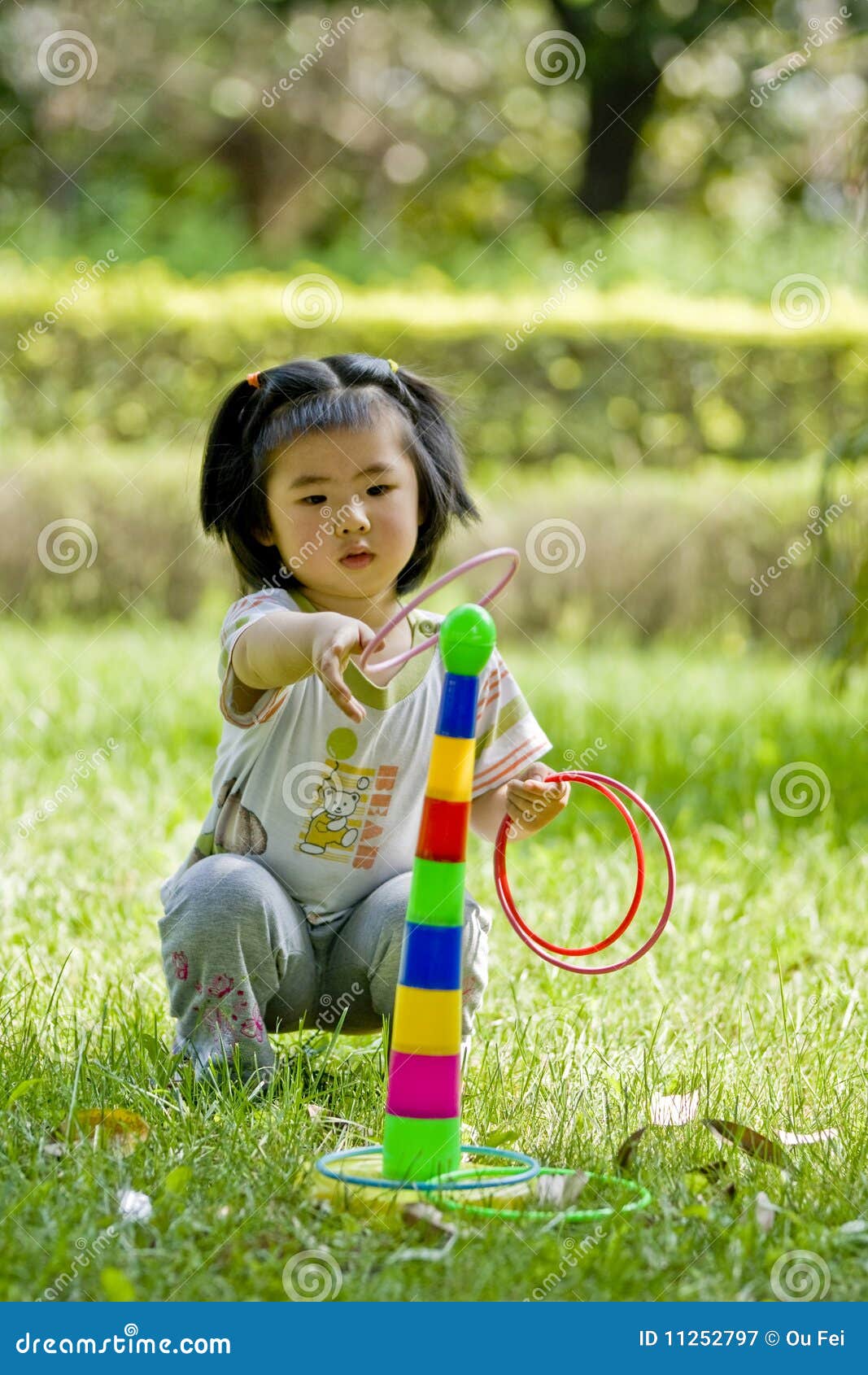 Girl playing quoits stock image. Image of grassland, child - 11252797