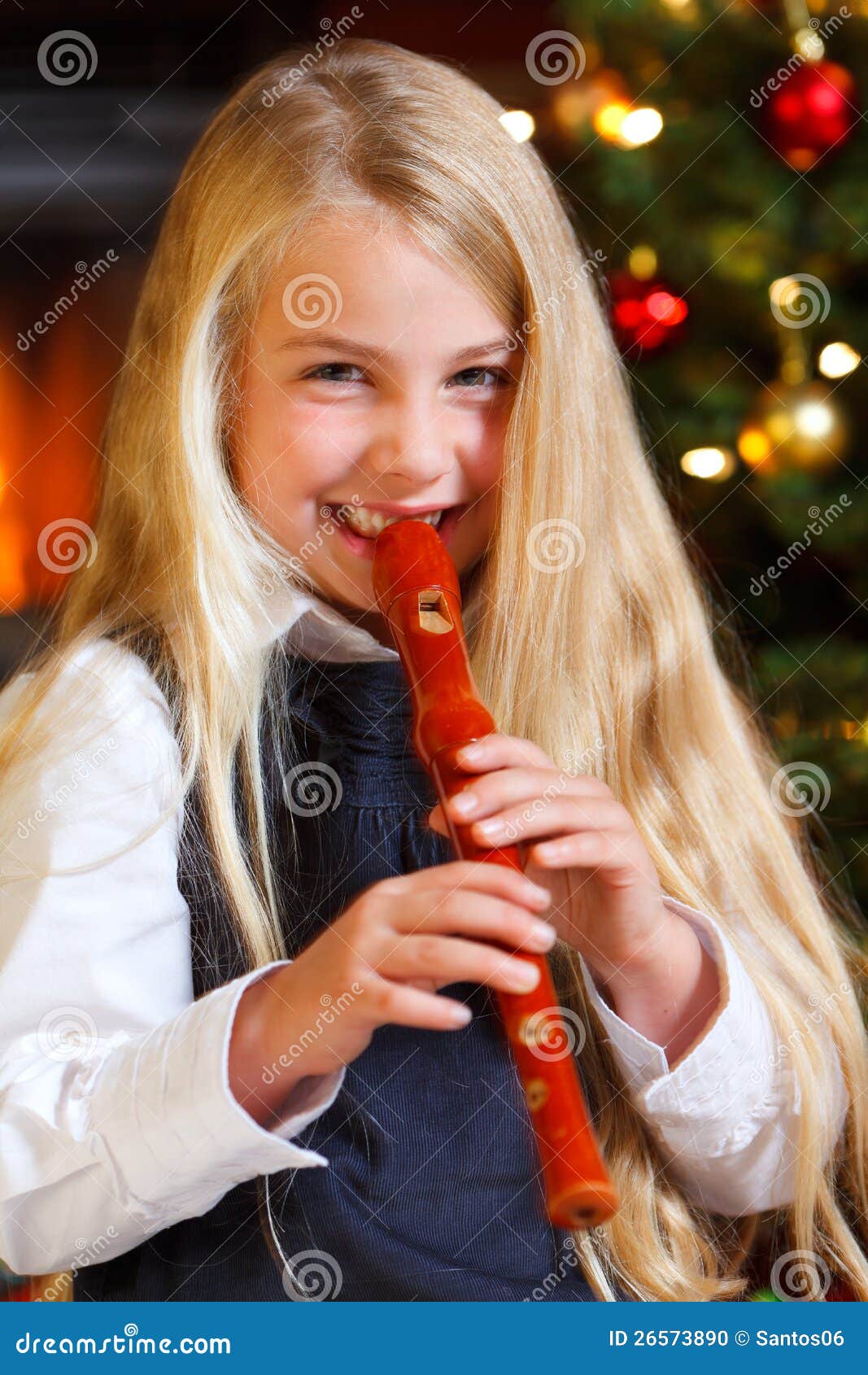 Girl Playing Recorder on Christmas Eve Stock Photo - Image of family ...