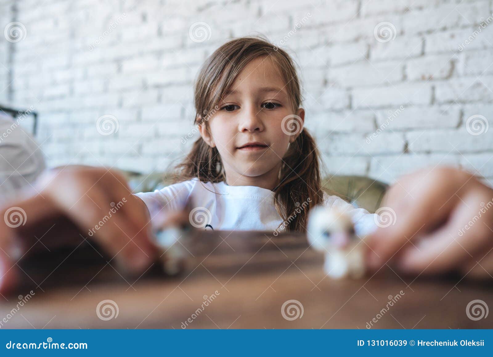 Girl Playing with Small Figures Sitting on Soft Stock Image - Image of ...