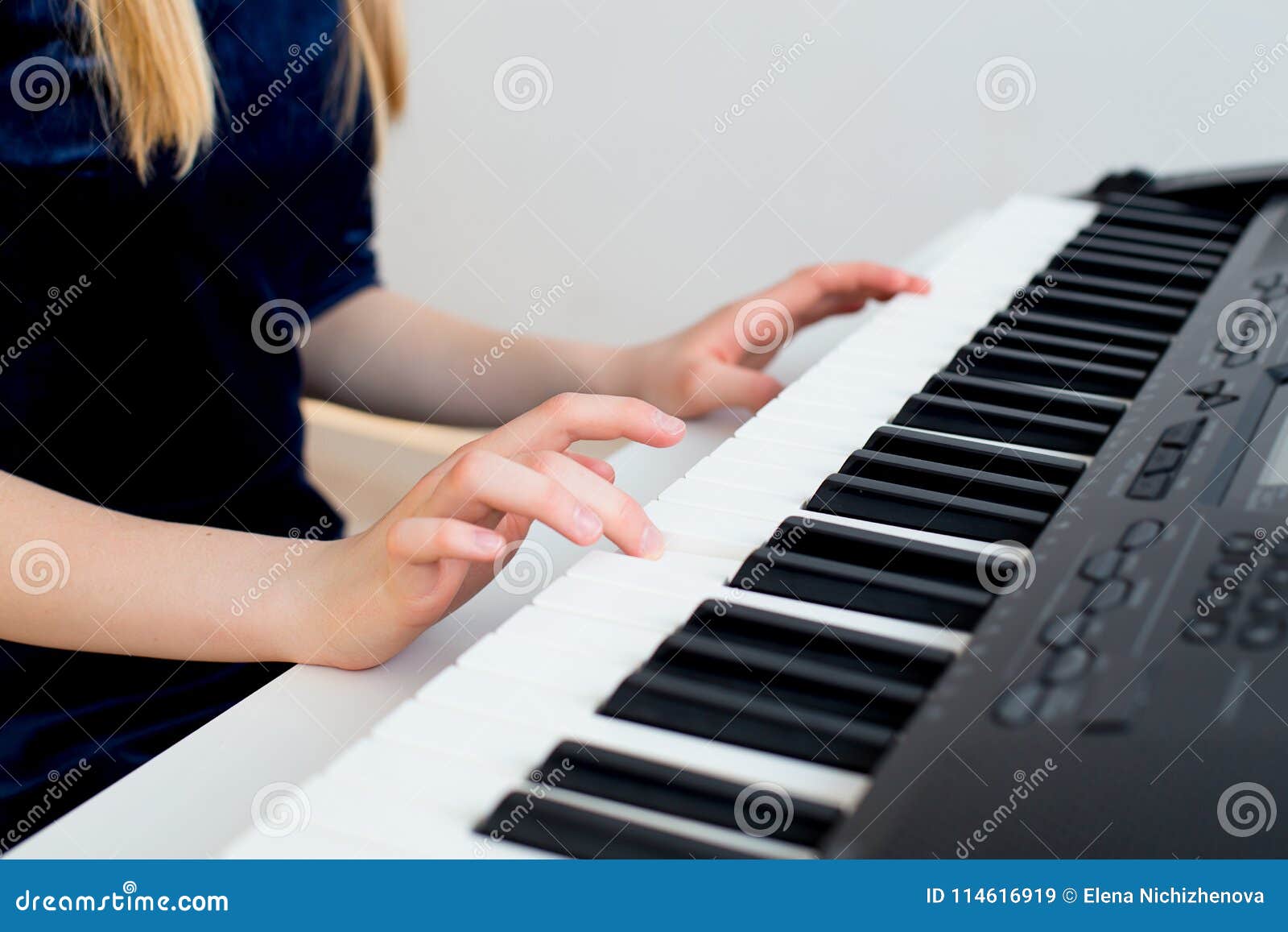 Girl playing synthesizer stock image. Image of female - 114616919