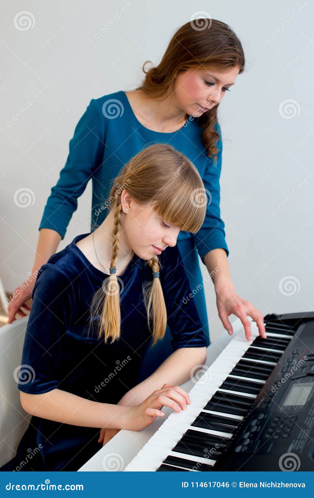 Girl playing synthesizer stock photo. Image of composer - 114617046