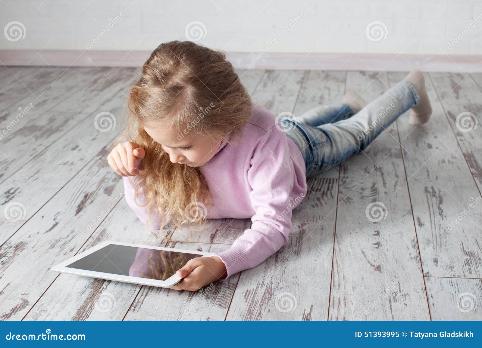 Girl playing tablet pc stock image. Image of shot, head - 51393995