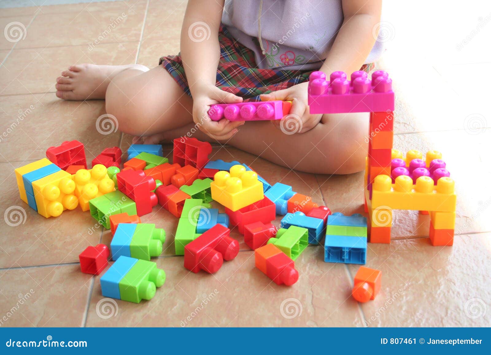 Girl playing toy blocks stock image. Image of happy, expression - 807461