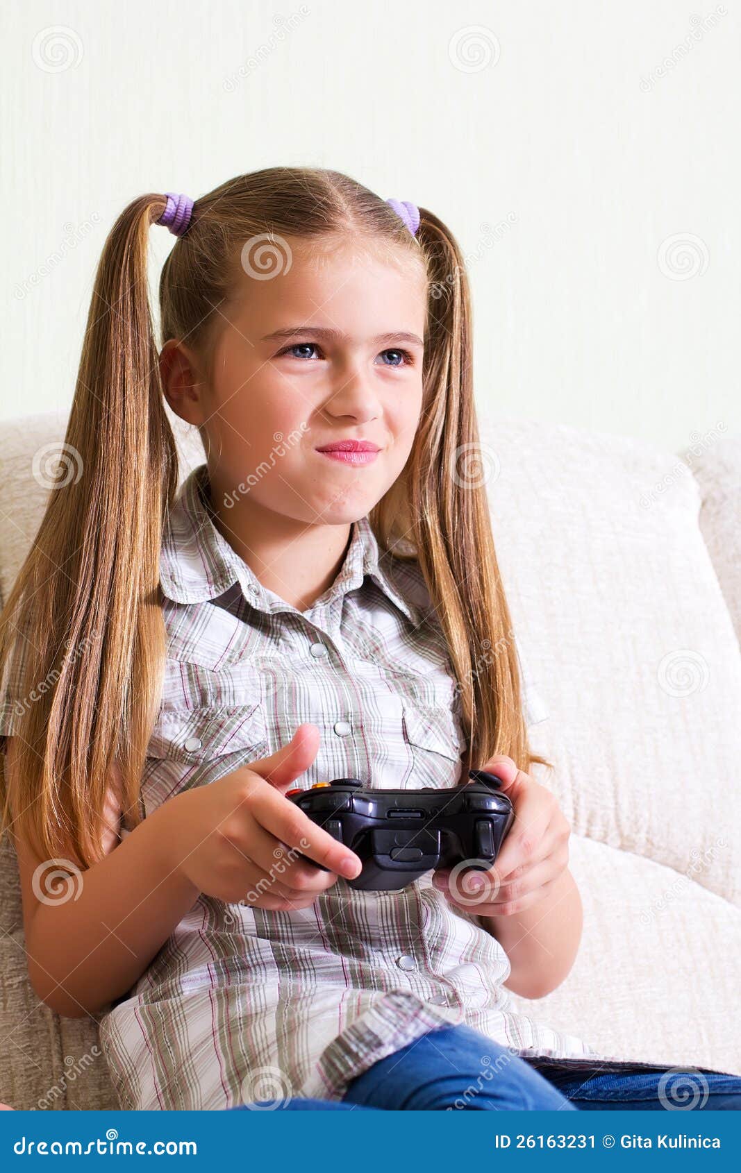 Girl playing video game. stock image. Image of indoors - 26163231