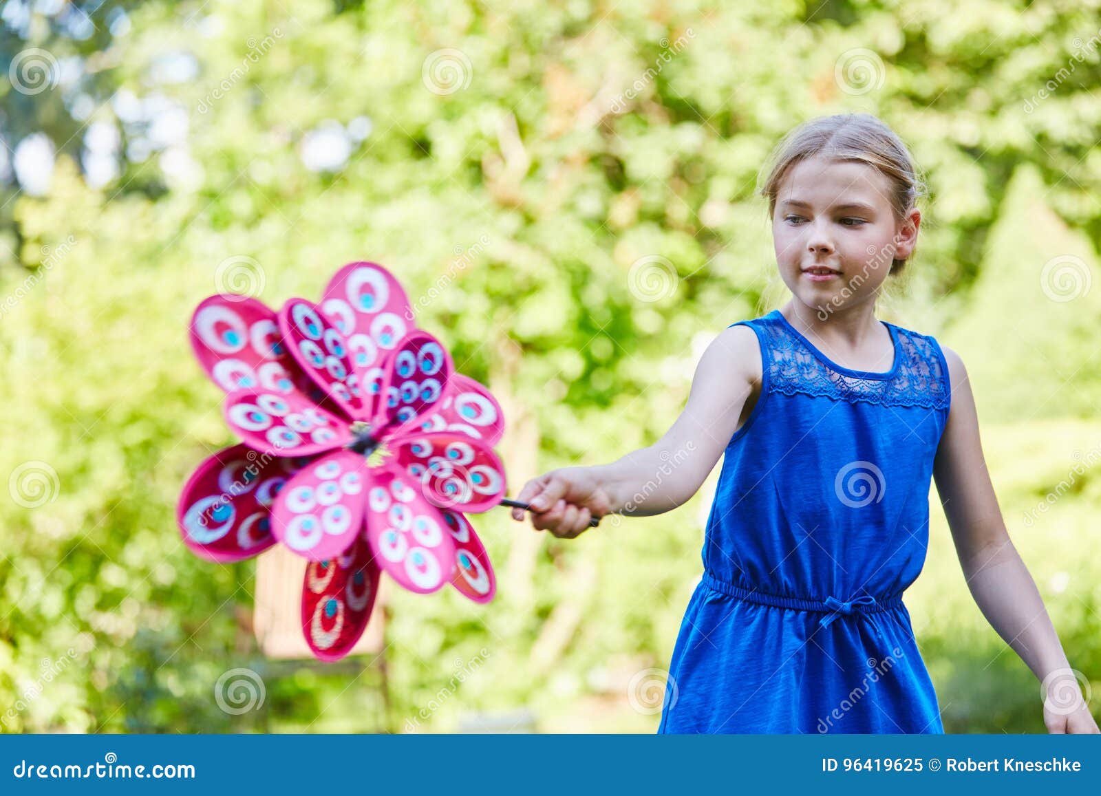 Girl playing with windmill stock image. Image of pinwheels - 96419625