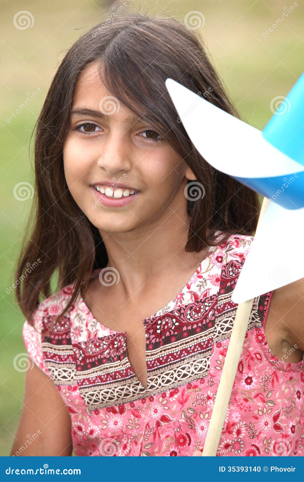 Girl playing with windmill stock photo. Image of playful - 35393140