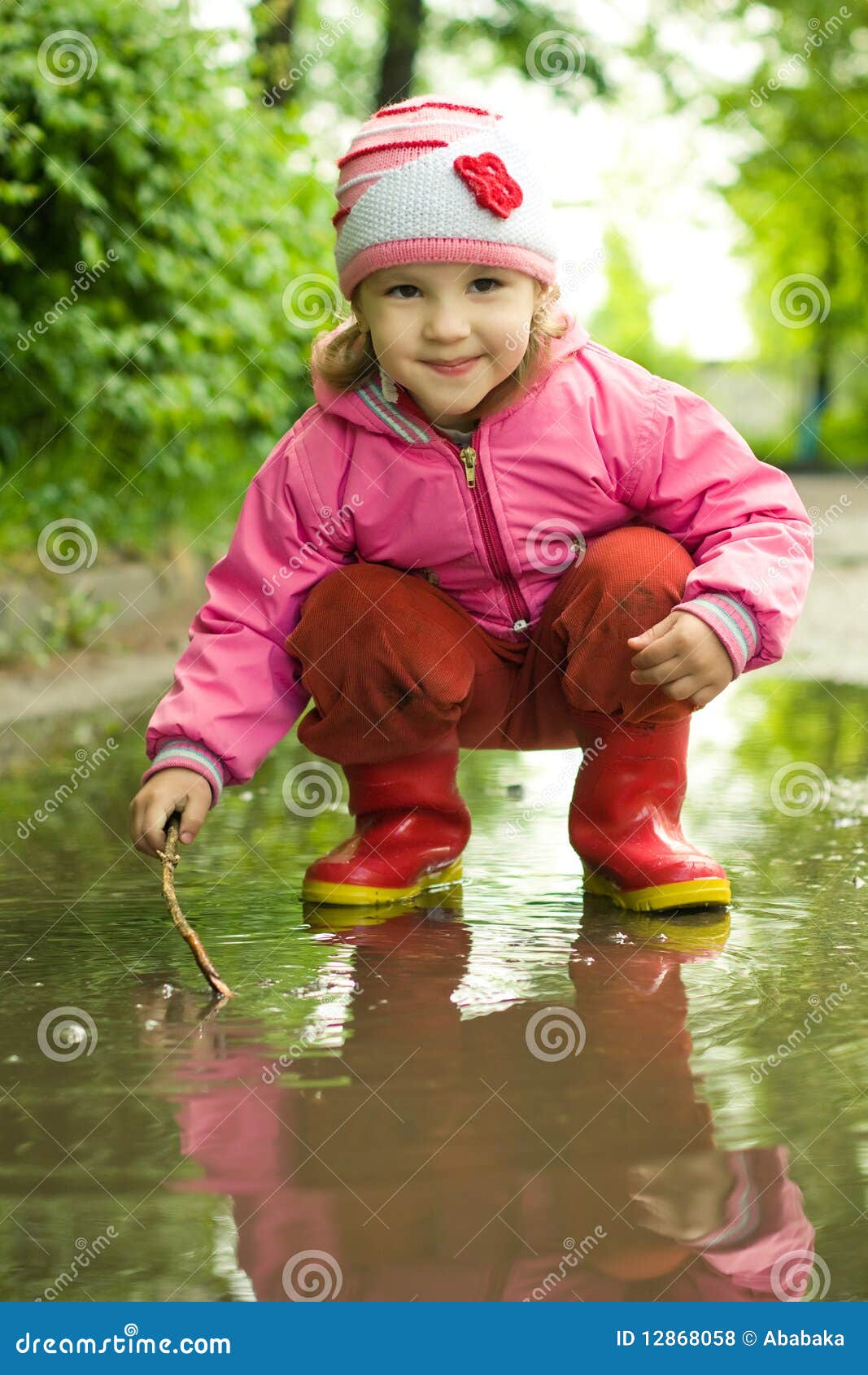 Girl plays in the puddle stock photo. Image of laughter - 12868058
