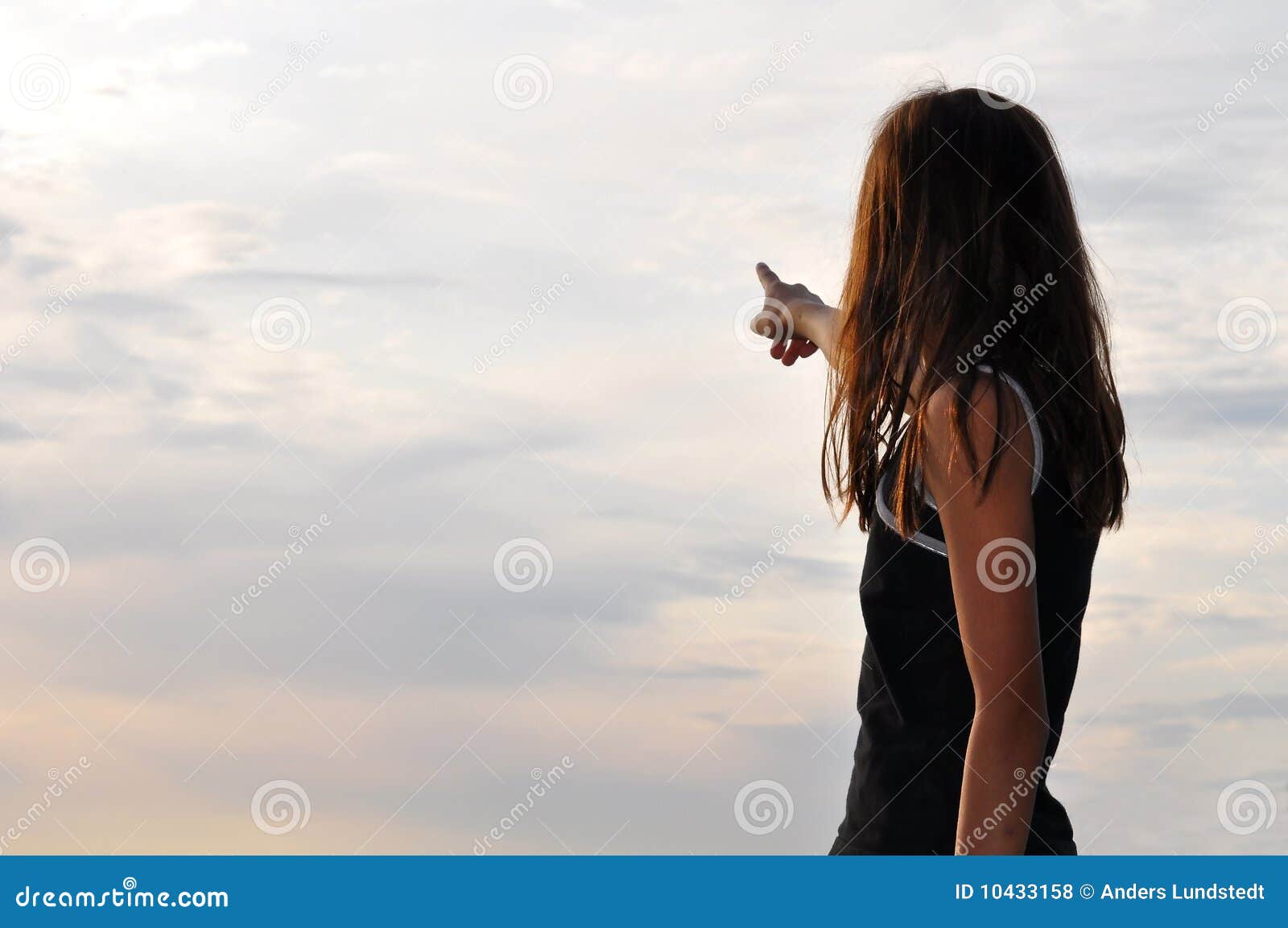 Girl Pointing Out To Clouded Sky Stock Photo - Image of hand, sees ...