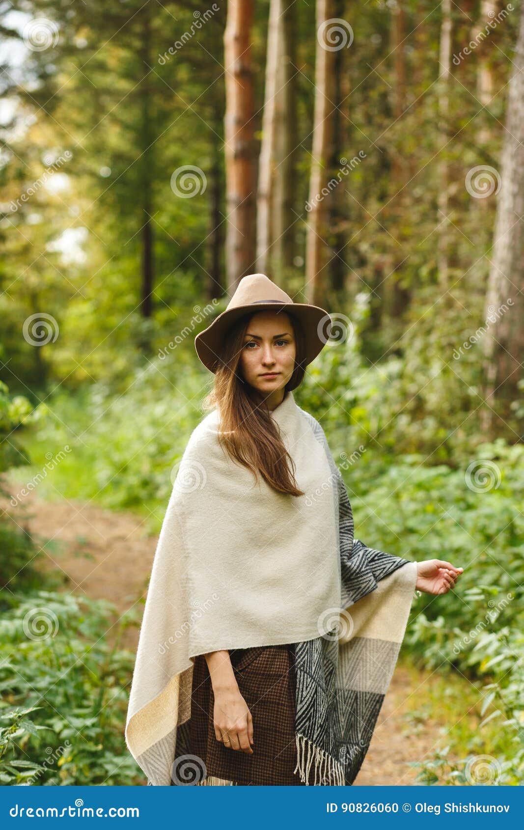 A Girl in a Poncho and a Hat in Forest Stock Photo - Image of green ...