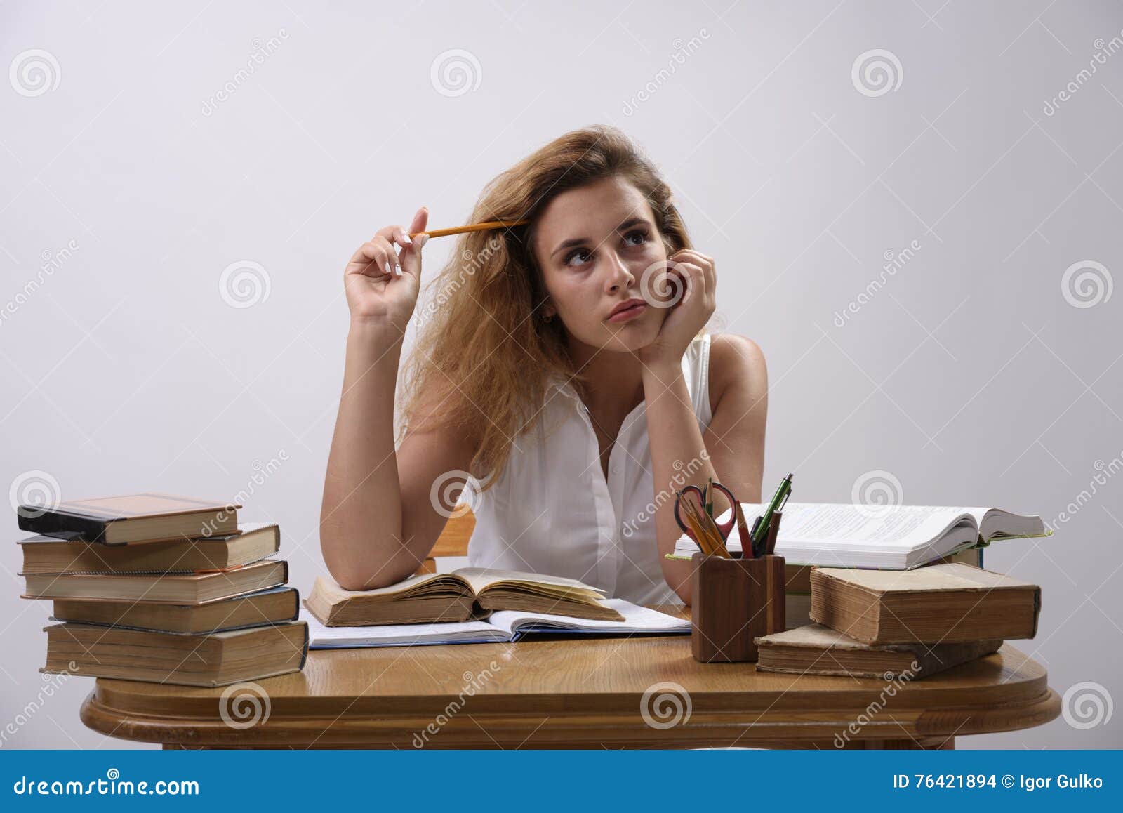 The Girl is Pondering the Solution To the Problem Stock Photo - Image ...