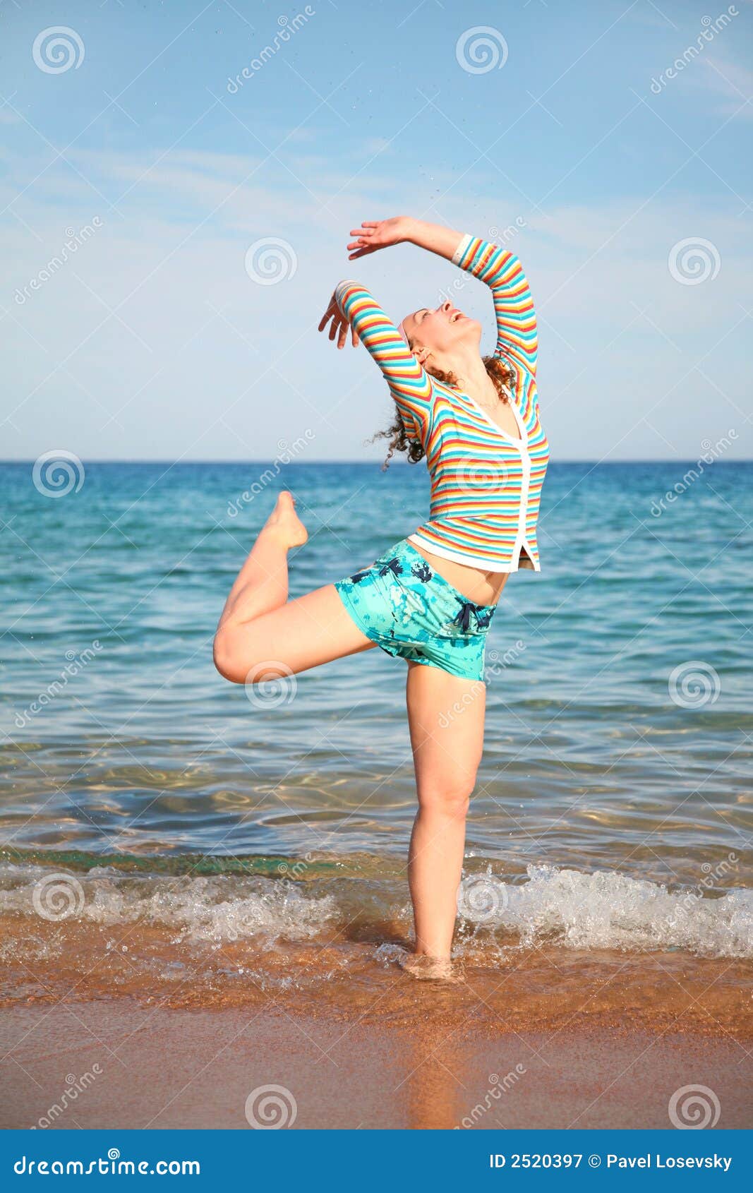 Girl poses on a beach stock image. Image of stretcing - 2520397