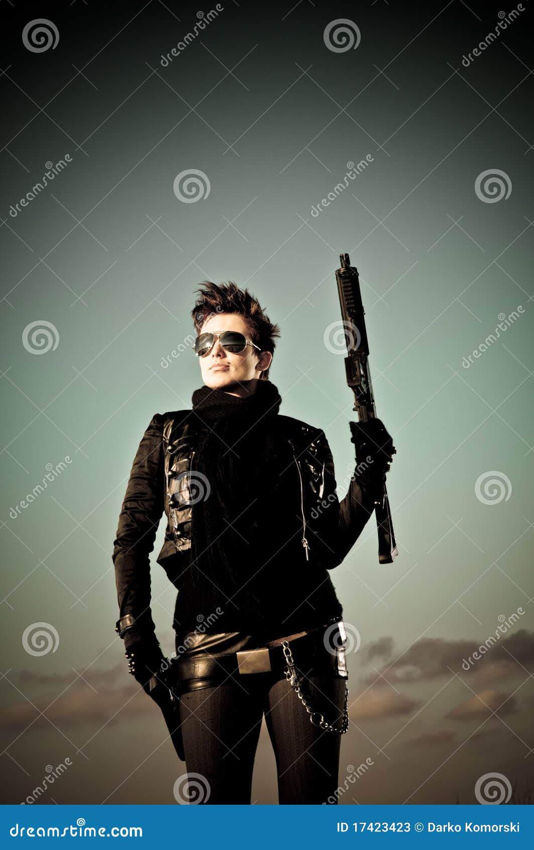 Girl posing with a gun stock image. Image of professional - 17423423