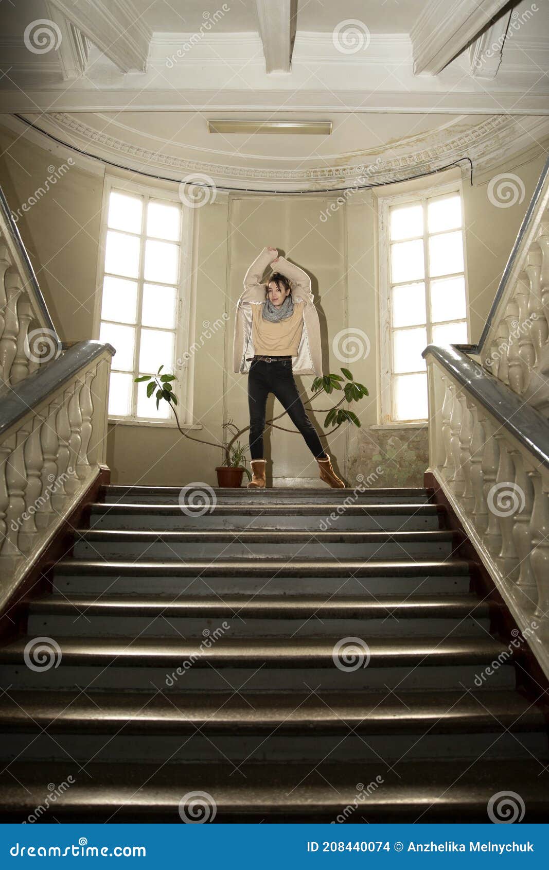 Girl Posing in a Hall with Windows and Stairs Stock Photo - Image of ...