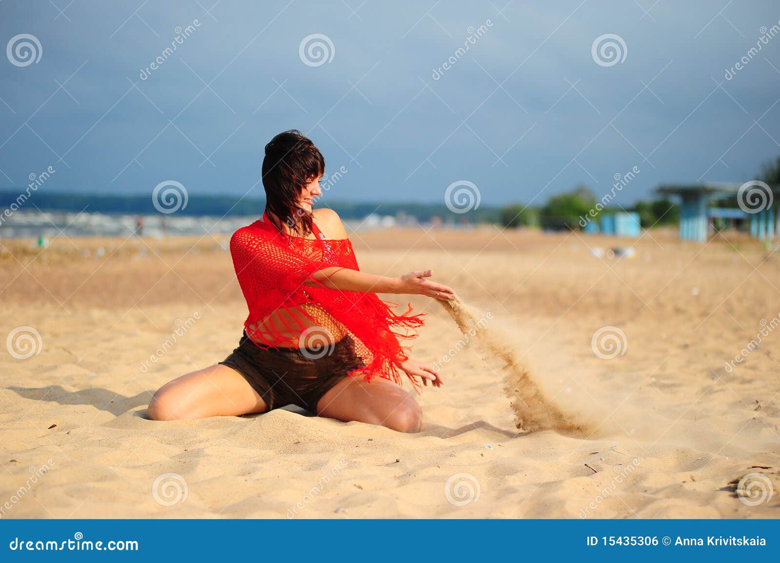 The girl pouring out sand stock photo. Image of coastline - 15435306