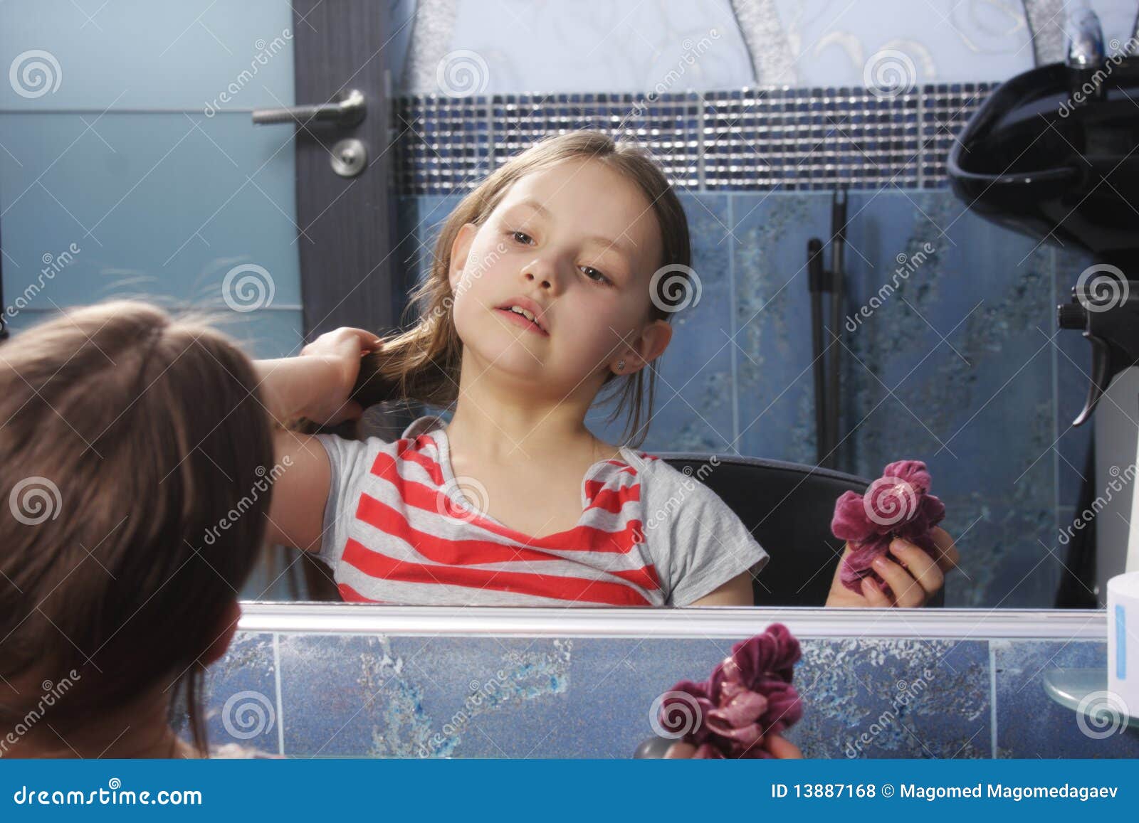 Girl preening at mirror stock photo. Image of child, hair - 13887168