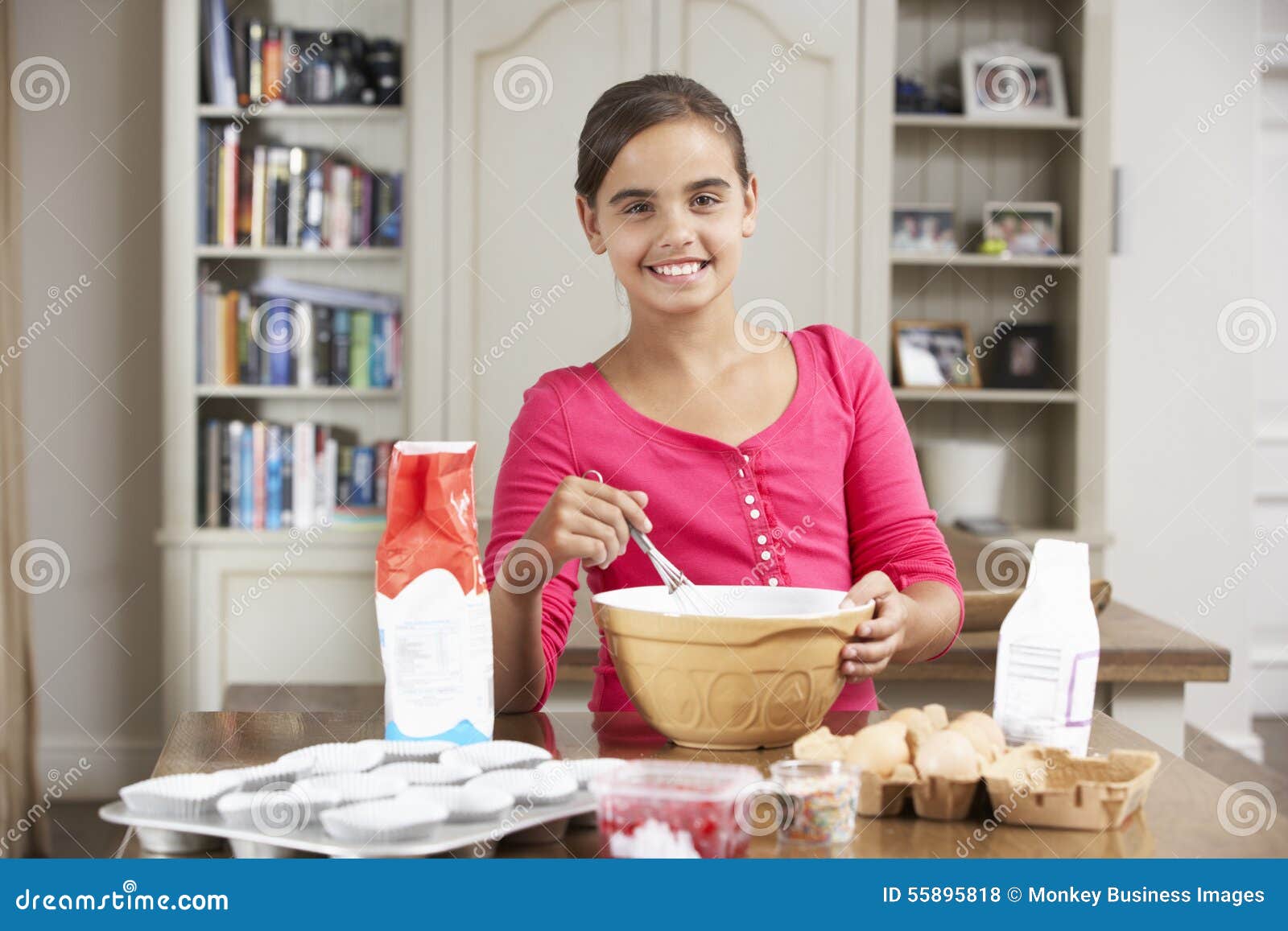 Girl Preparing Ingredients To Bake Cakes in Kitchen Stock Photo - Image ...
