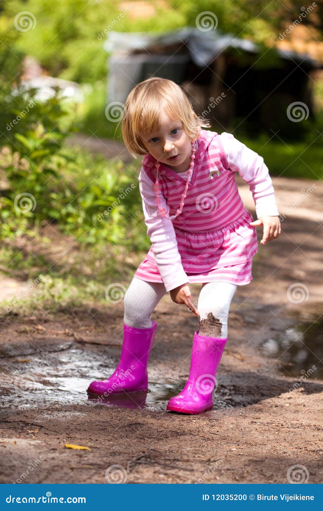 Girl in a puddle stock photo. Image of muddy, happy, amaze - 12035200