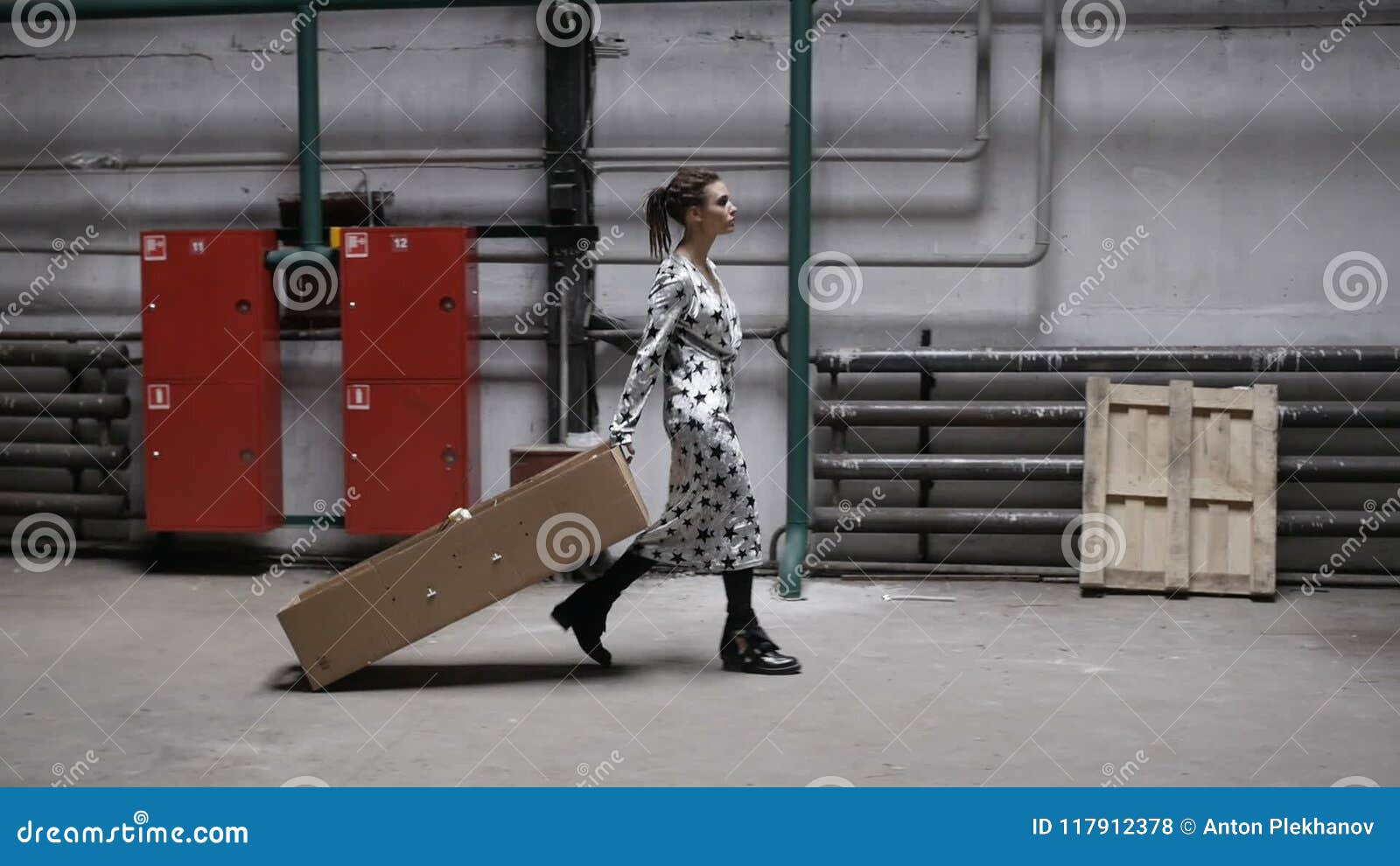 Girl is pulling the box stock footage. Video of building - 117912378
