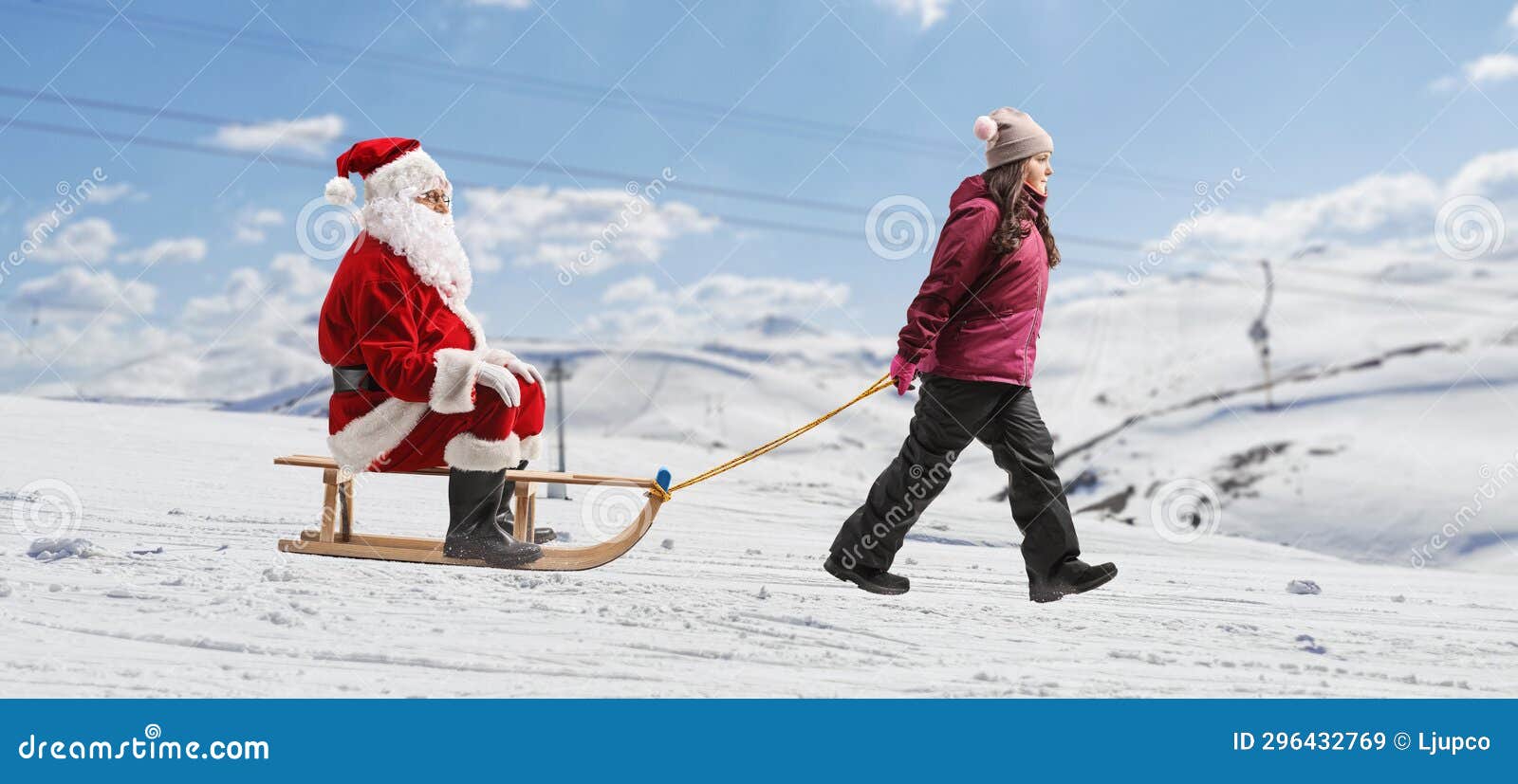 Girl Pulling a Sleigh with Santa Claus on a Mountain Stock Image ...