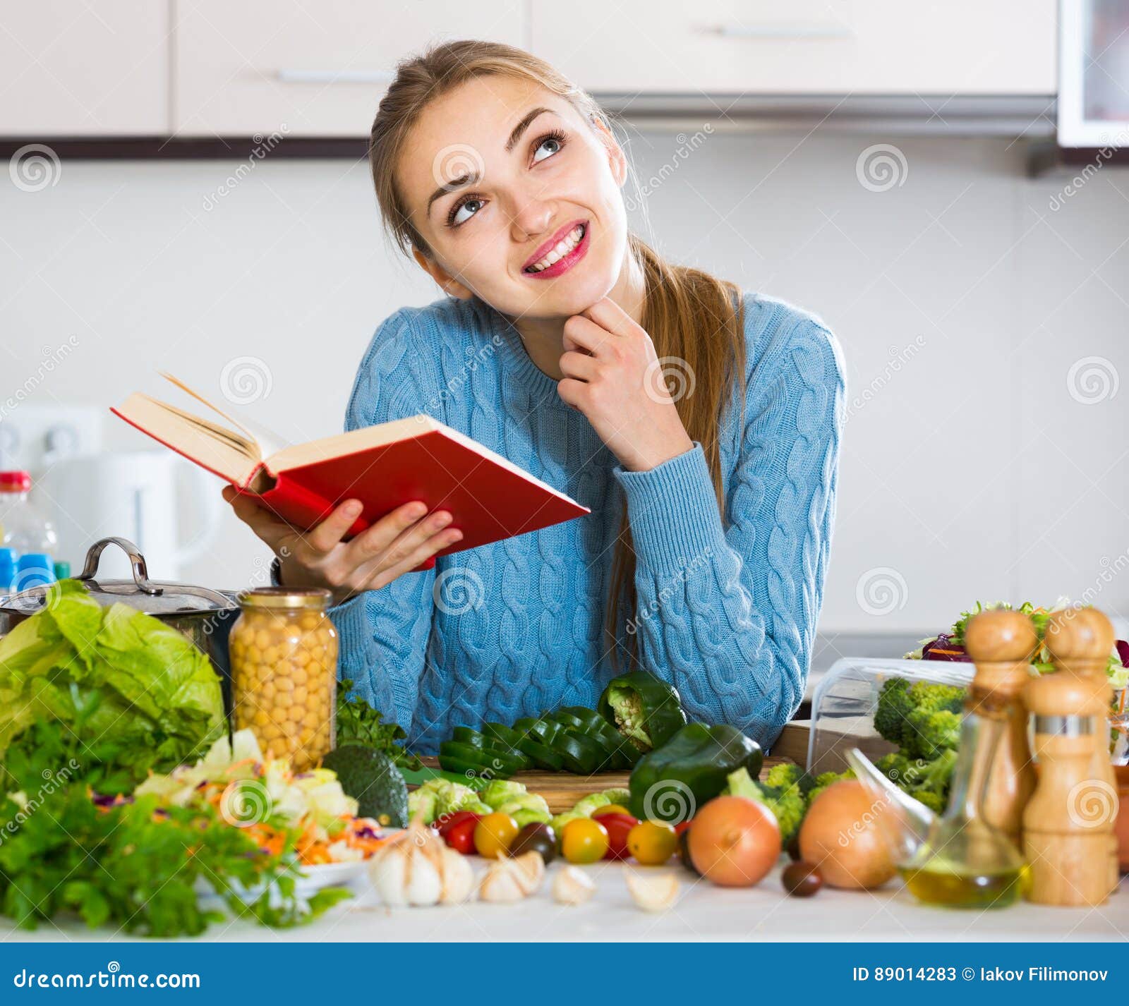Girl in Pullover Learning New Recipe from Cookbook Stock Image - Image ...