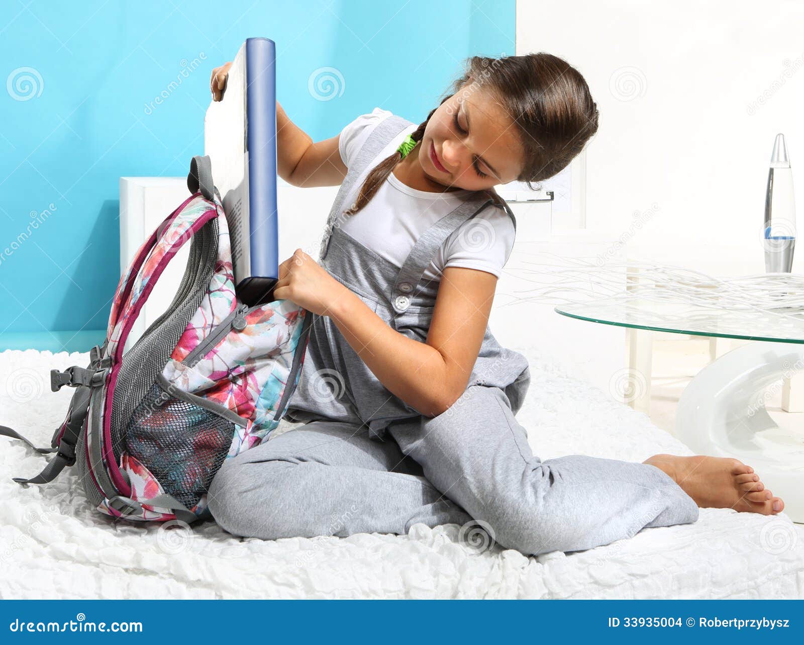 Girl Put the Book into a Backpack Stock Photo - Image of brynetka, book ...