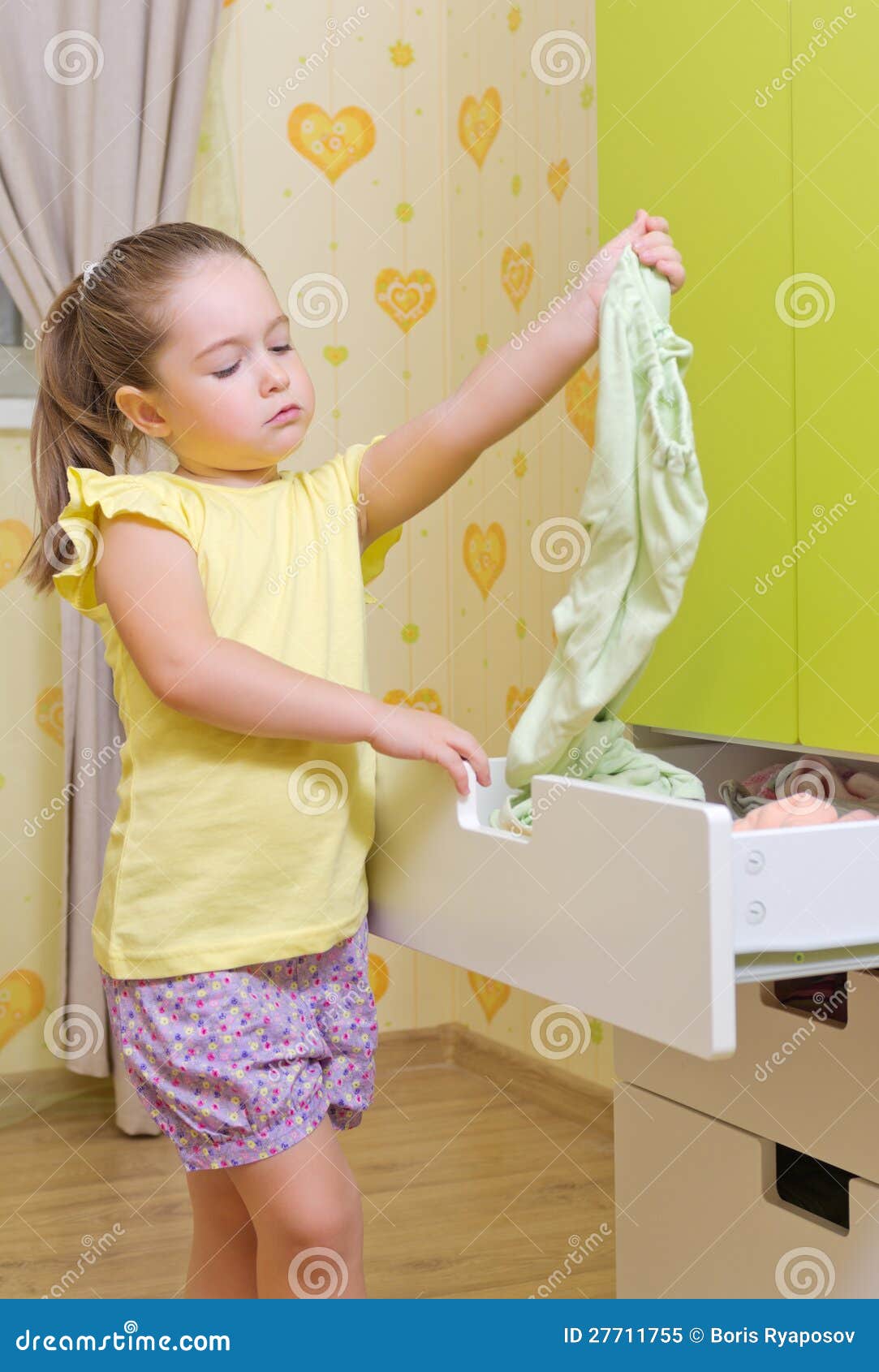 Girl Put a Clothes To Case Box in a Home Stock Image - Image of child ...