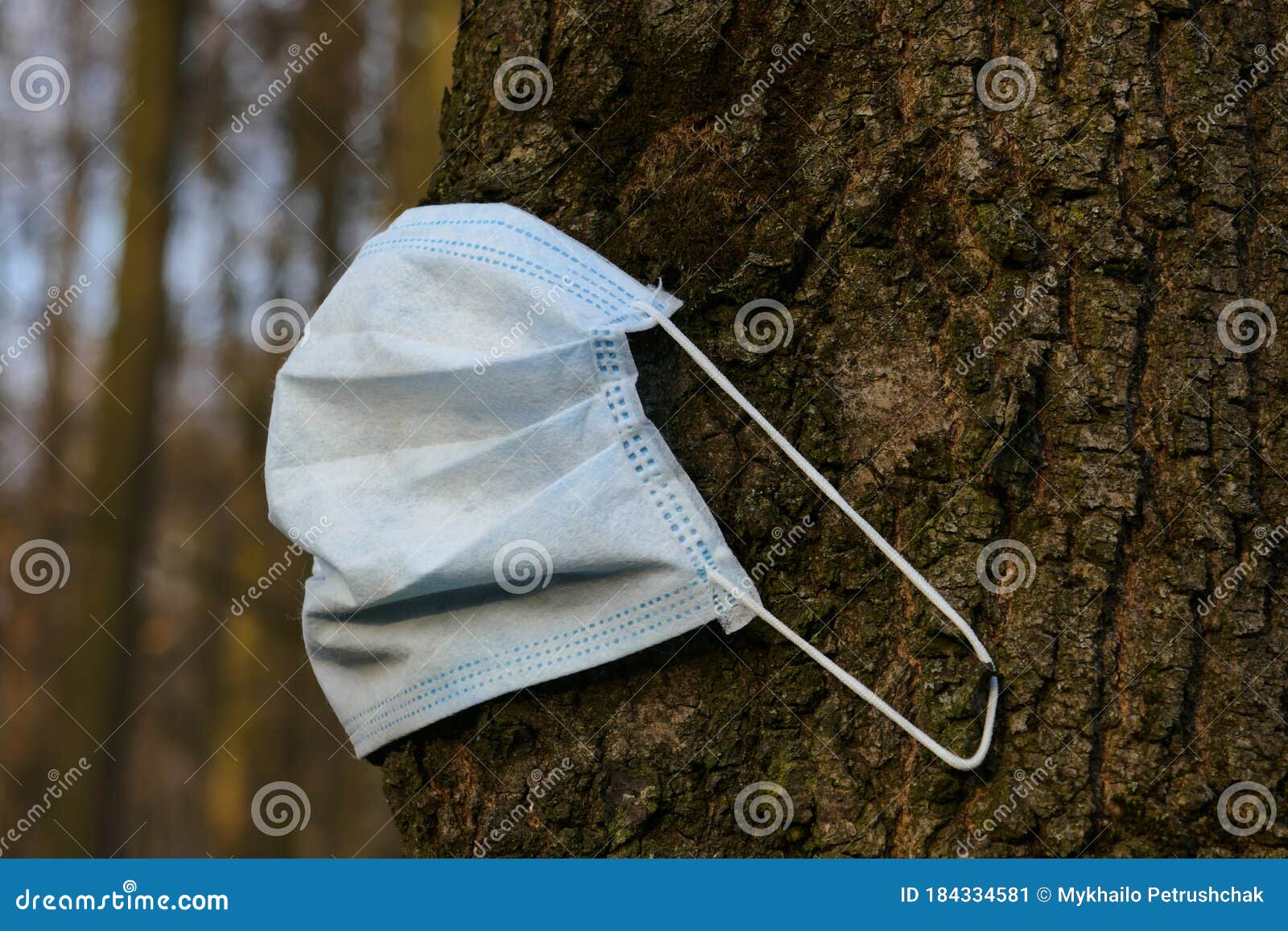 Girl Puts a Mask on the Tree Trunk, Protecting Nature from the Virus ...