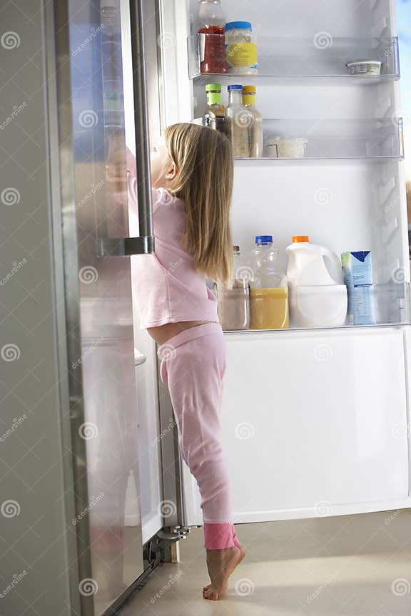 Girl Raiding the Fridge stock photo. Image of refridgerator - 55900046