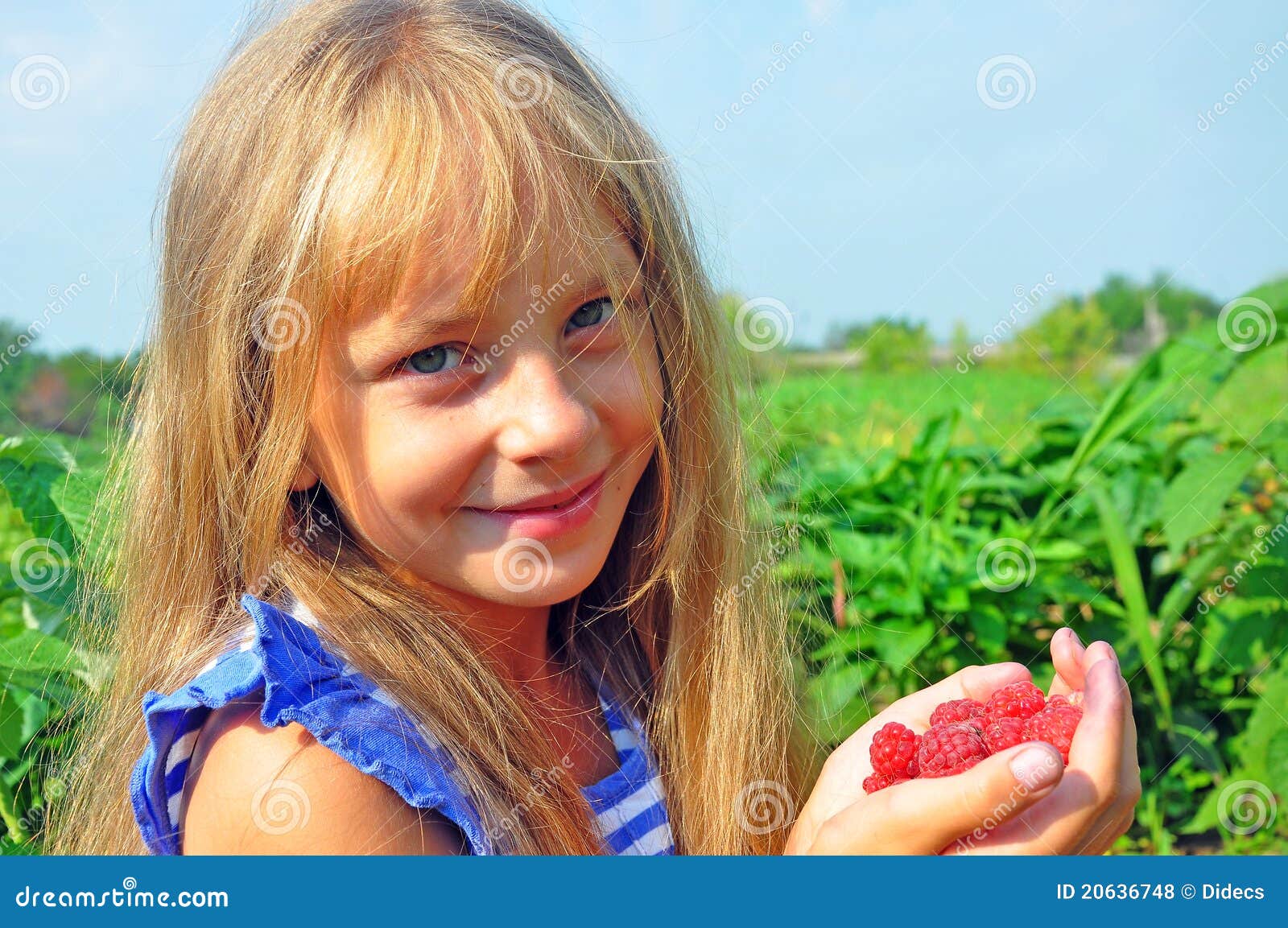 Girl with raspberries stock photo. Image of blond, smile - 20636748