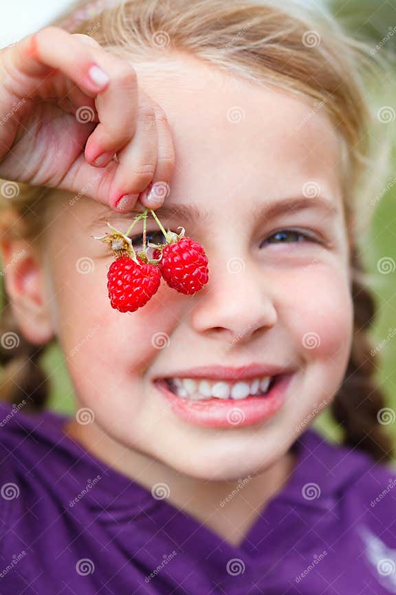 Girl with raspberries stock photo. Image of fruit, blond - 23642388