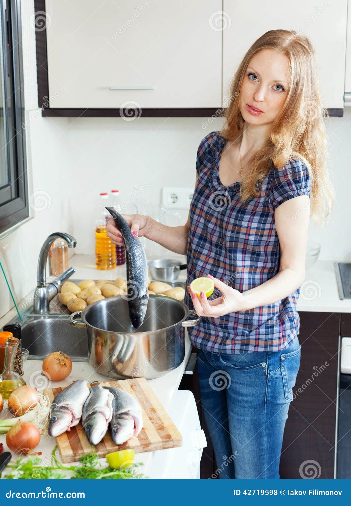 Girl with Raw Fish in Kitchen Stock Photo - Image of products ...